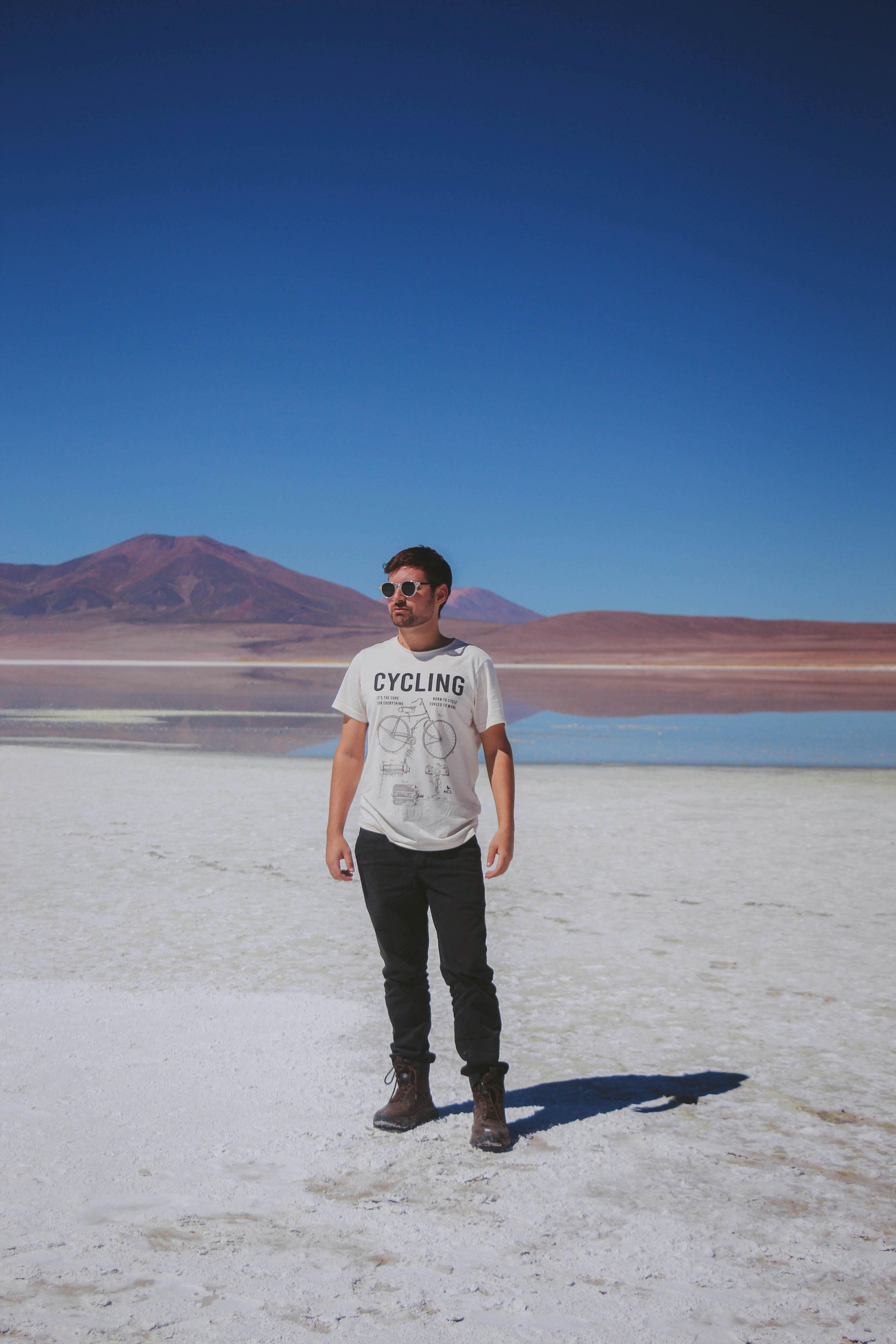 Cyclist in a Salt-Flat Sunset: A Solitary Stance