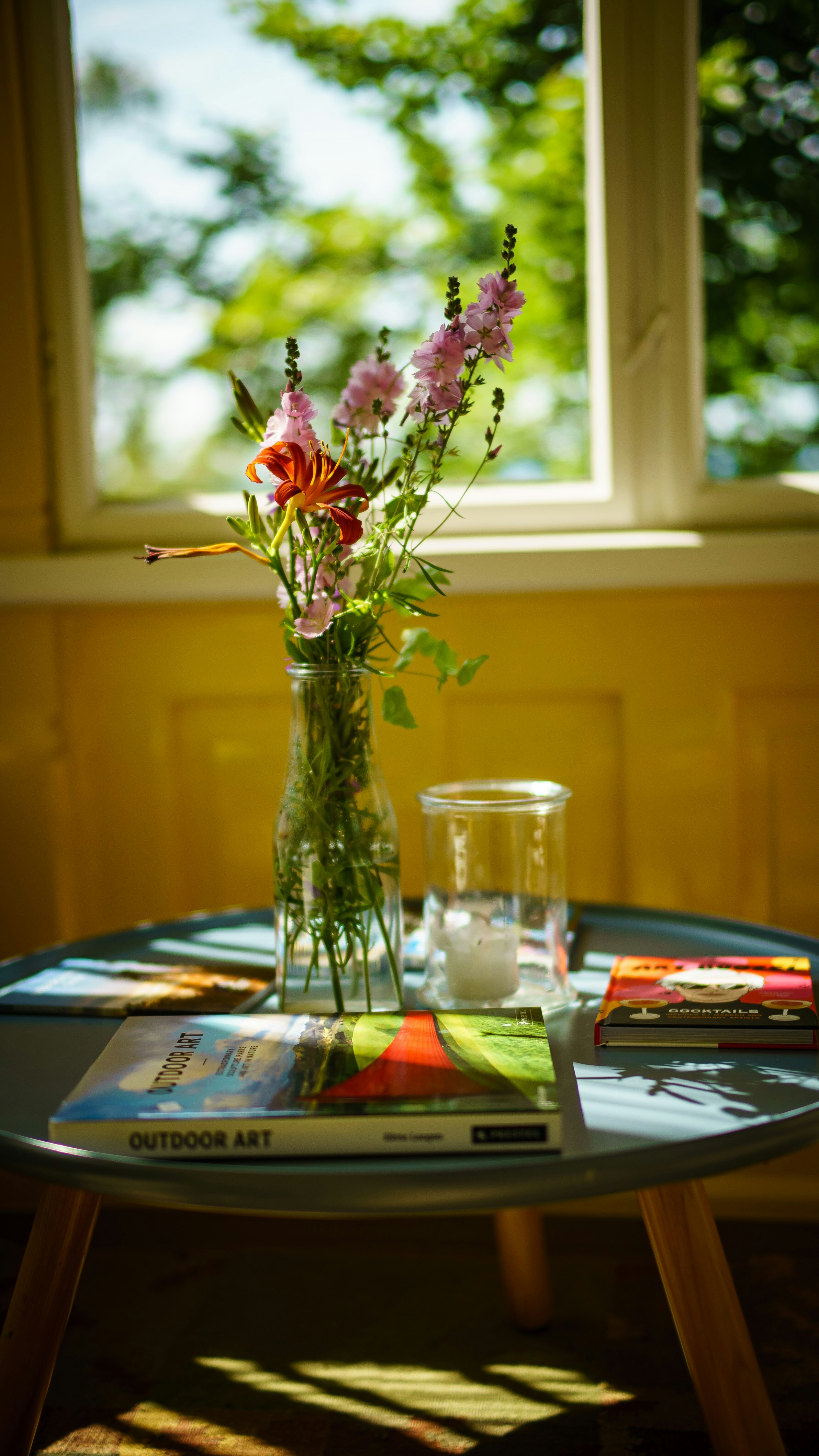 Sunlit Stillness: A Vase of Spring Blooms on a Quiet Table