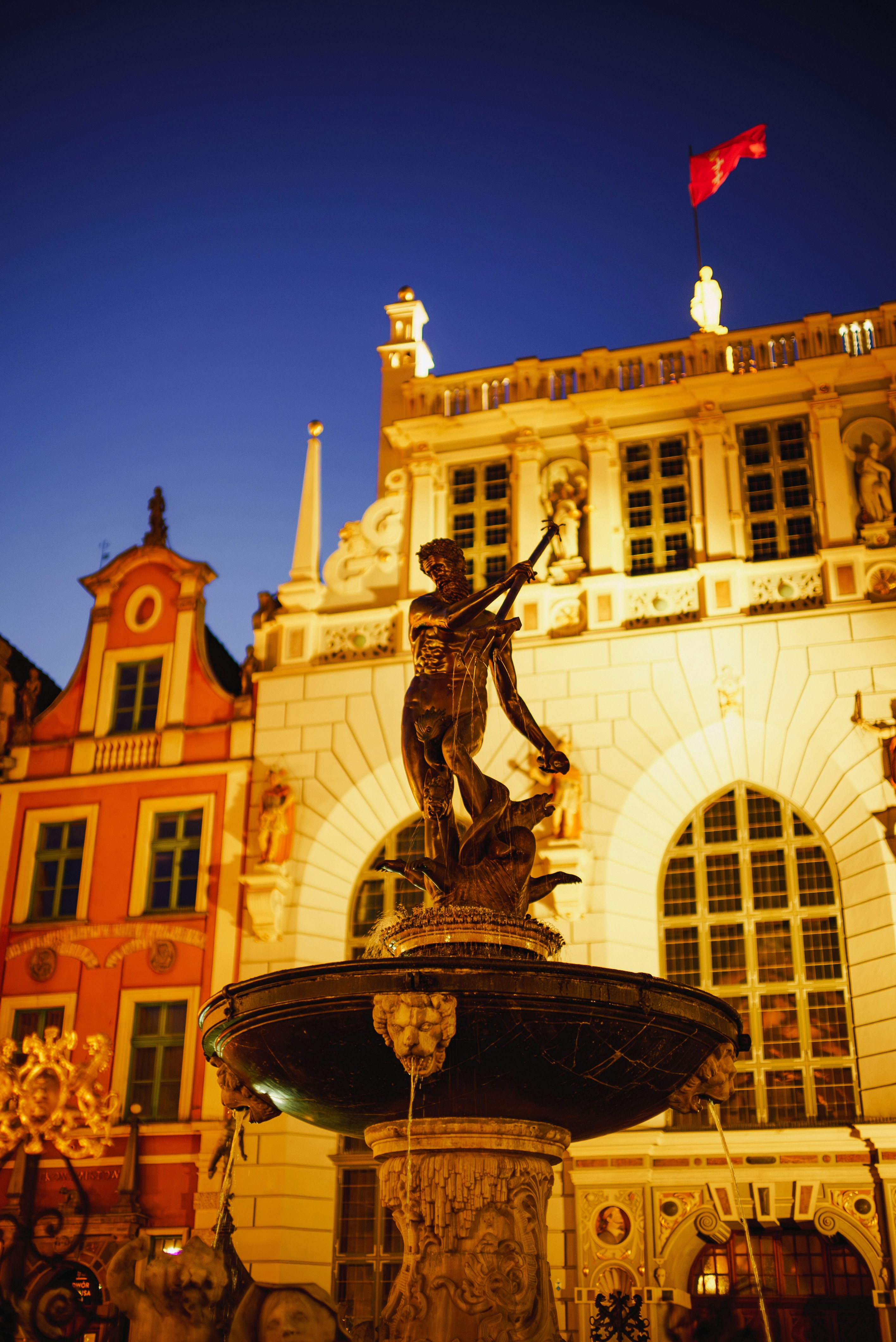 Nightfall in Prague: Statues, Lanterns, and a Fountain of Firelight