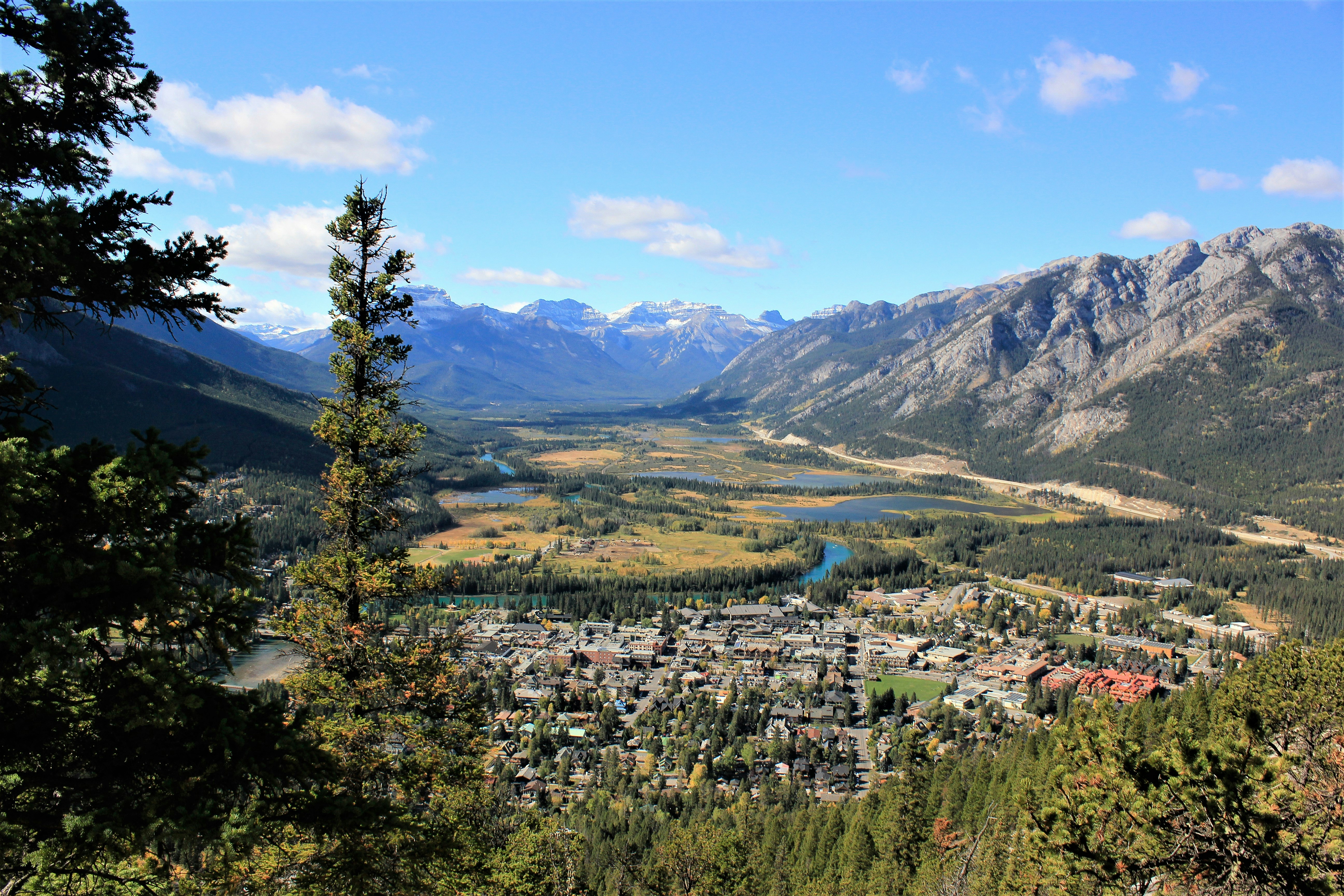 High Valley Vista: Town Below the Snow-Capped Spine
