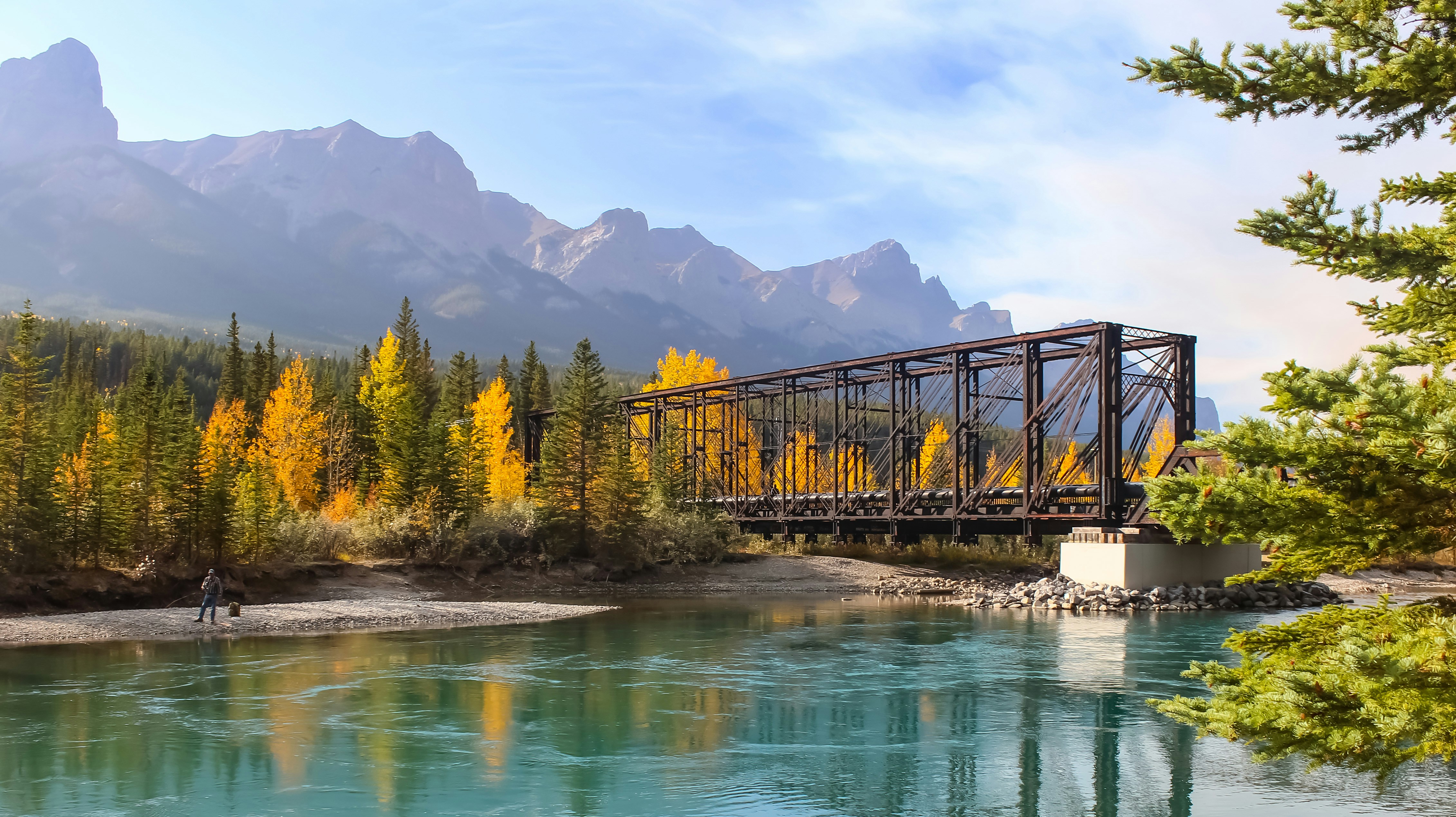 Autumn River Crossing: A Steel Bridge Between Forest and Water