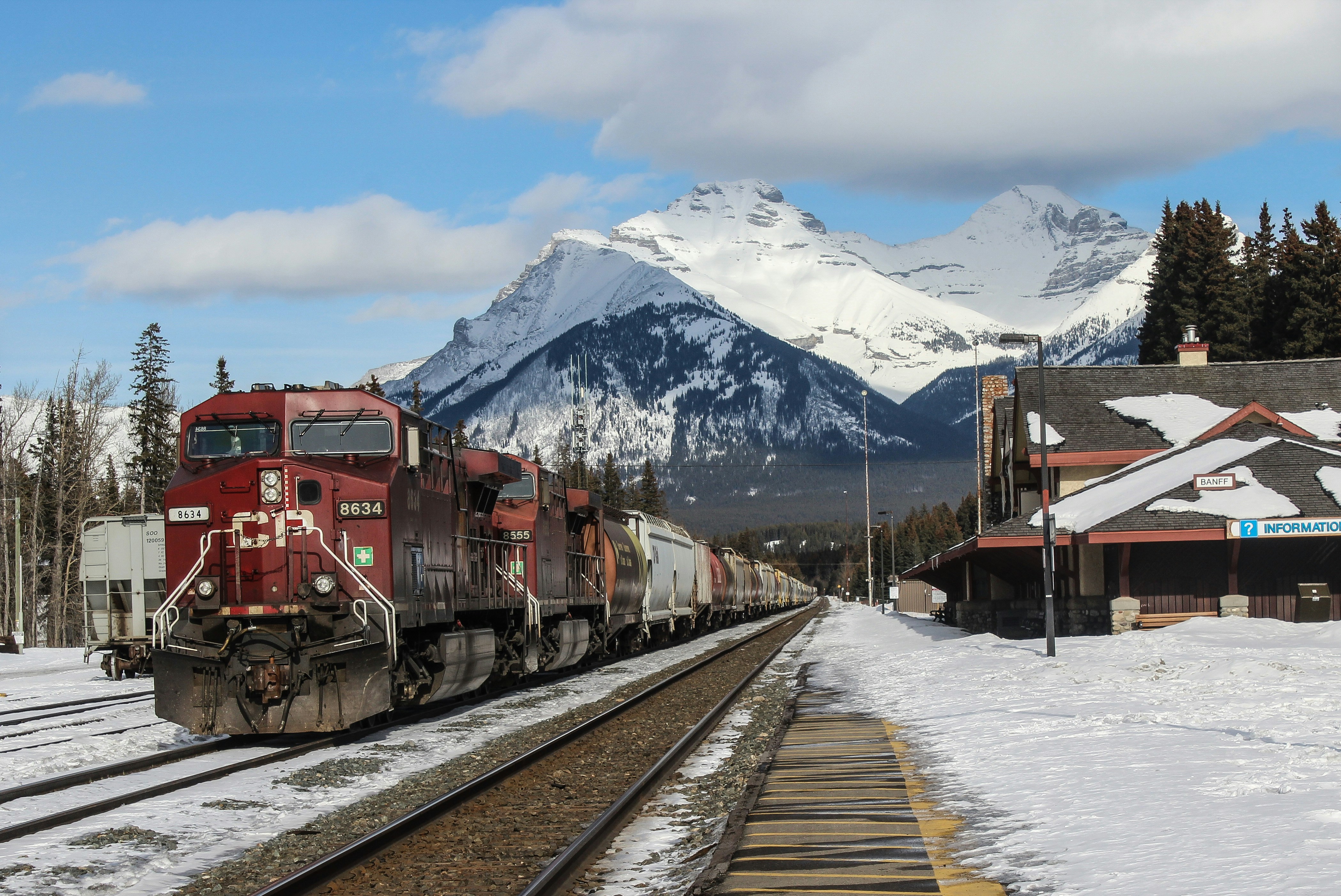 Snowbound Rails: Red Locomotives Fuel a Mountain Village