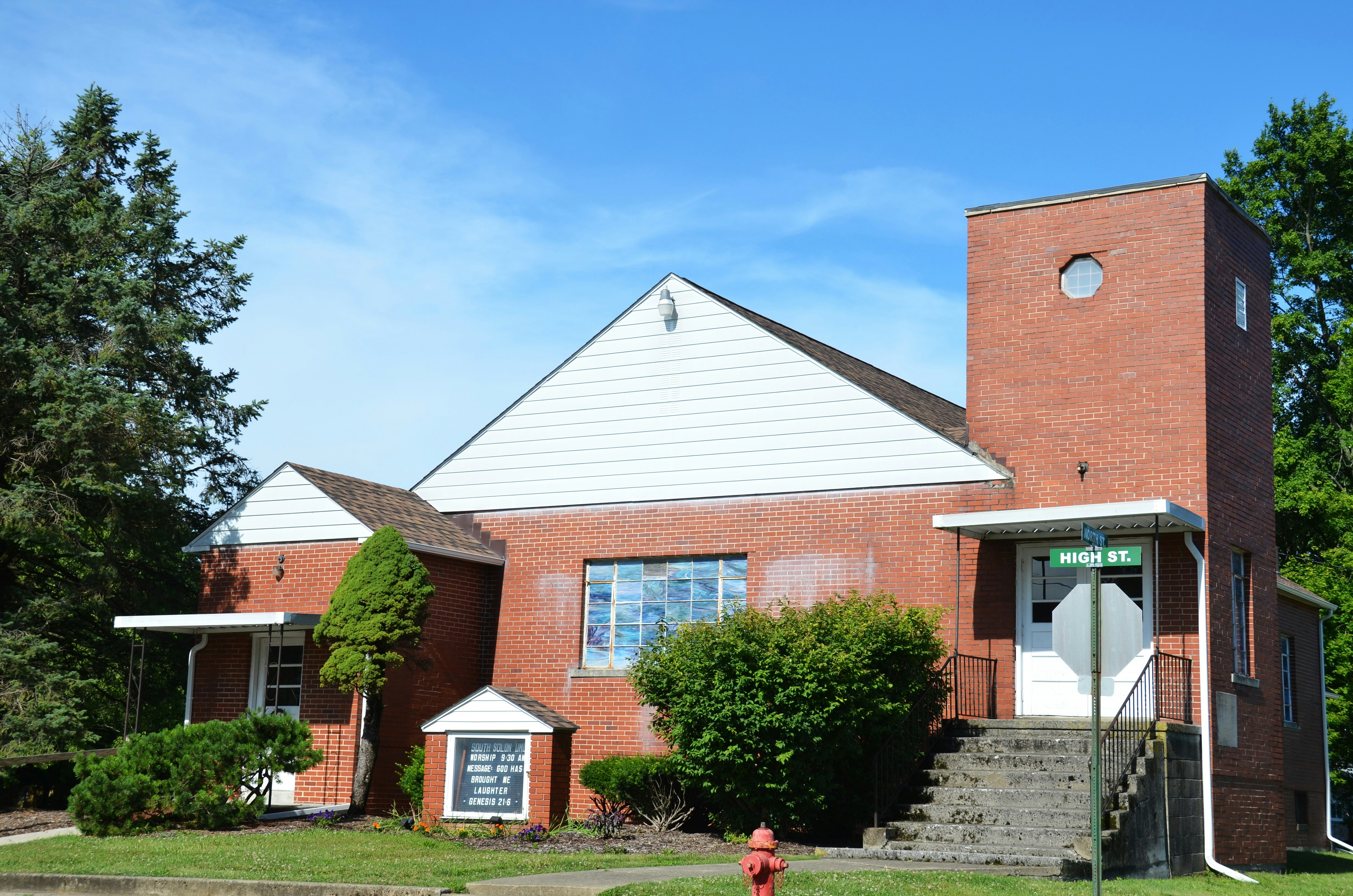 Brick Chapel: A Quiet Community Center Under a Bright Noon Sky