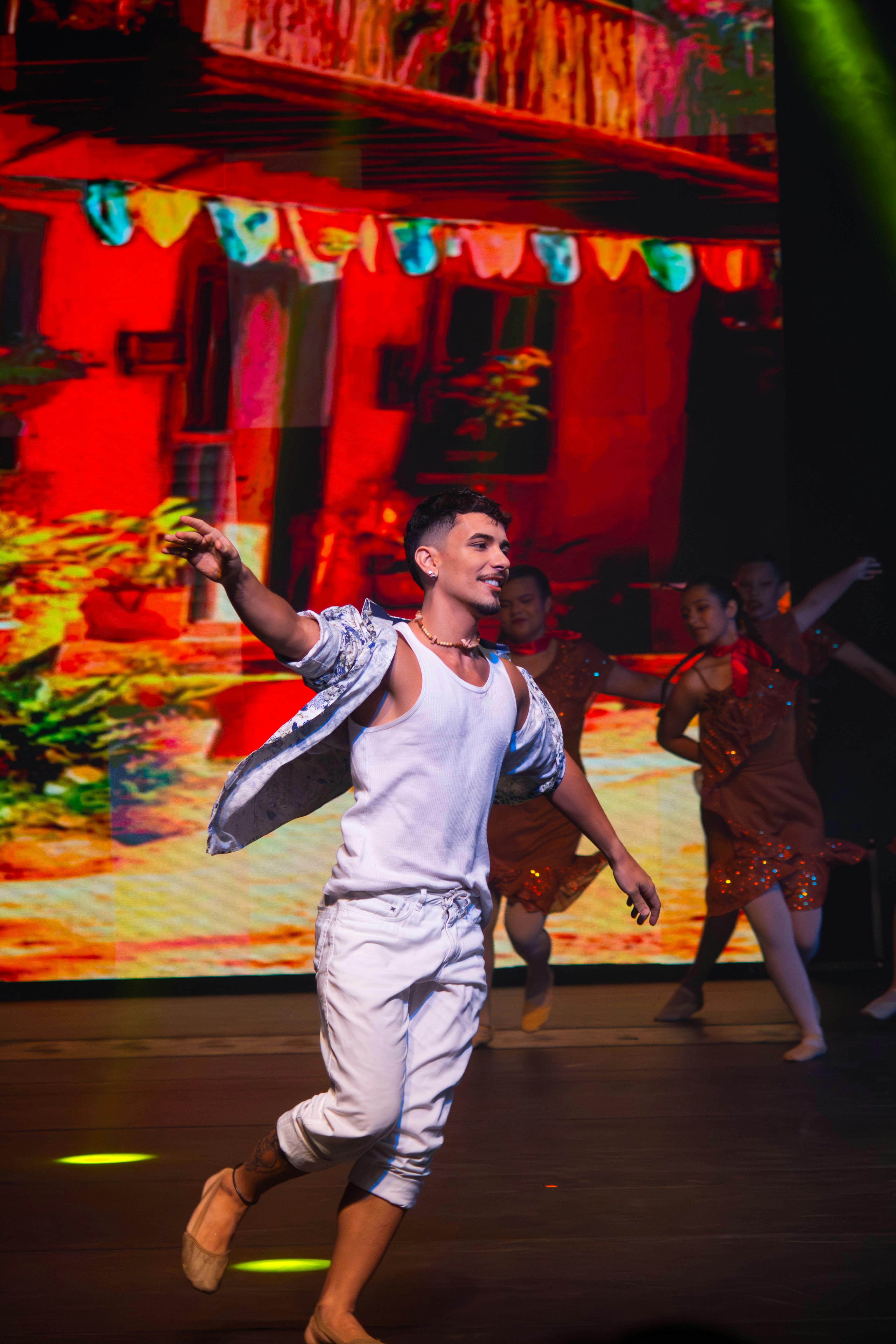 Dancer in Motion: A Solo Flourish on a Colorful Stage
