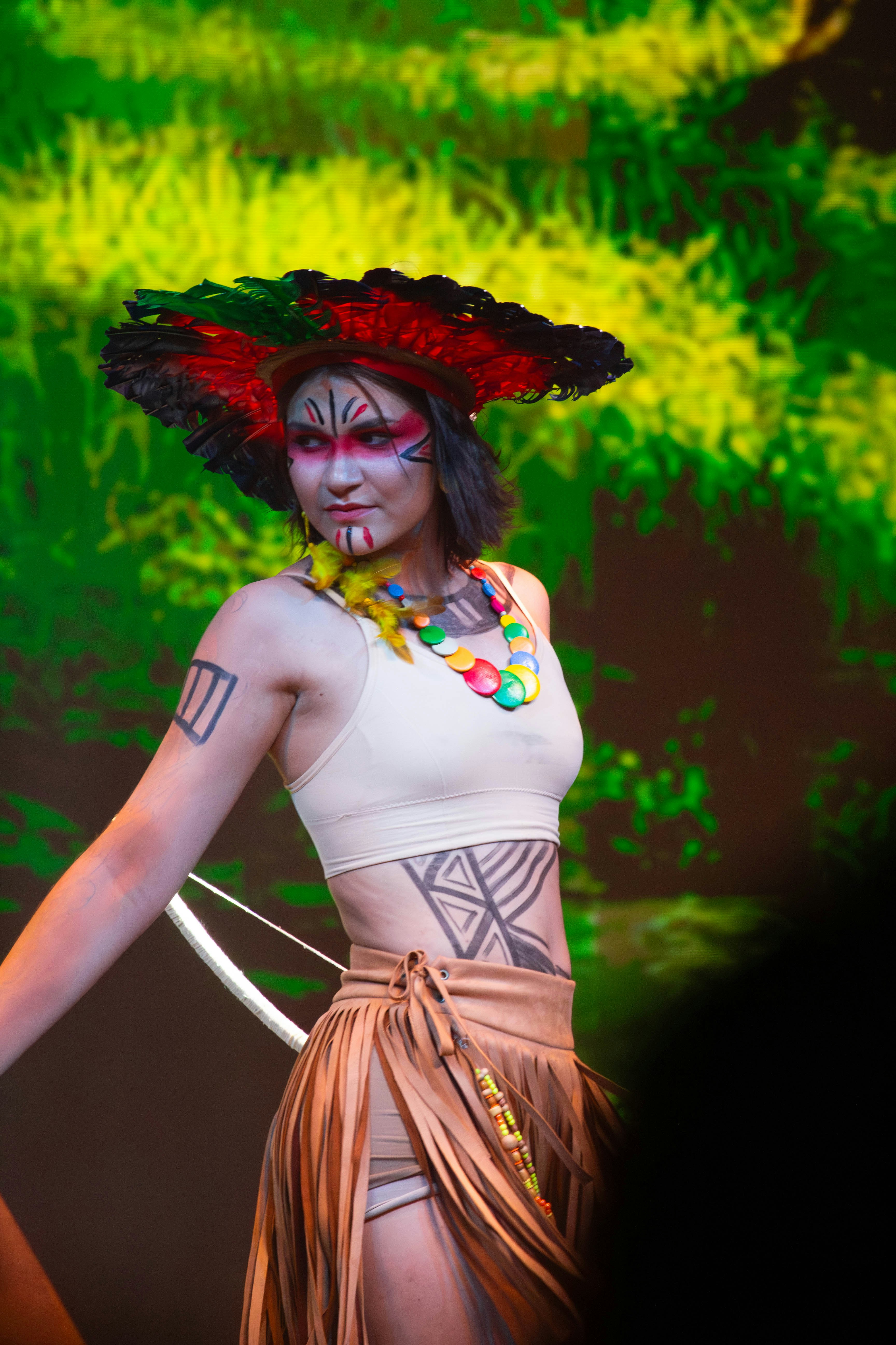 Festival of Faces: Painted Performer in a Feathered Headdress