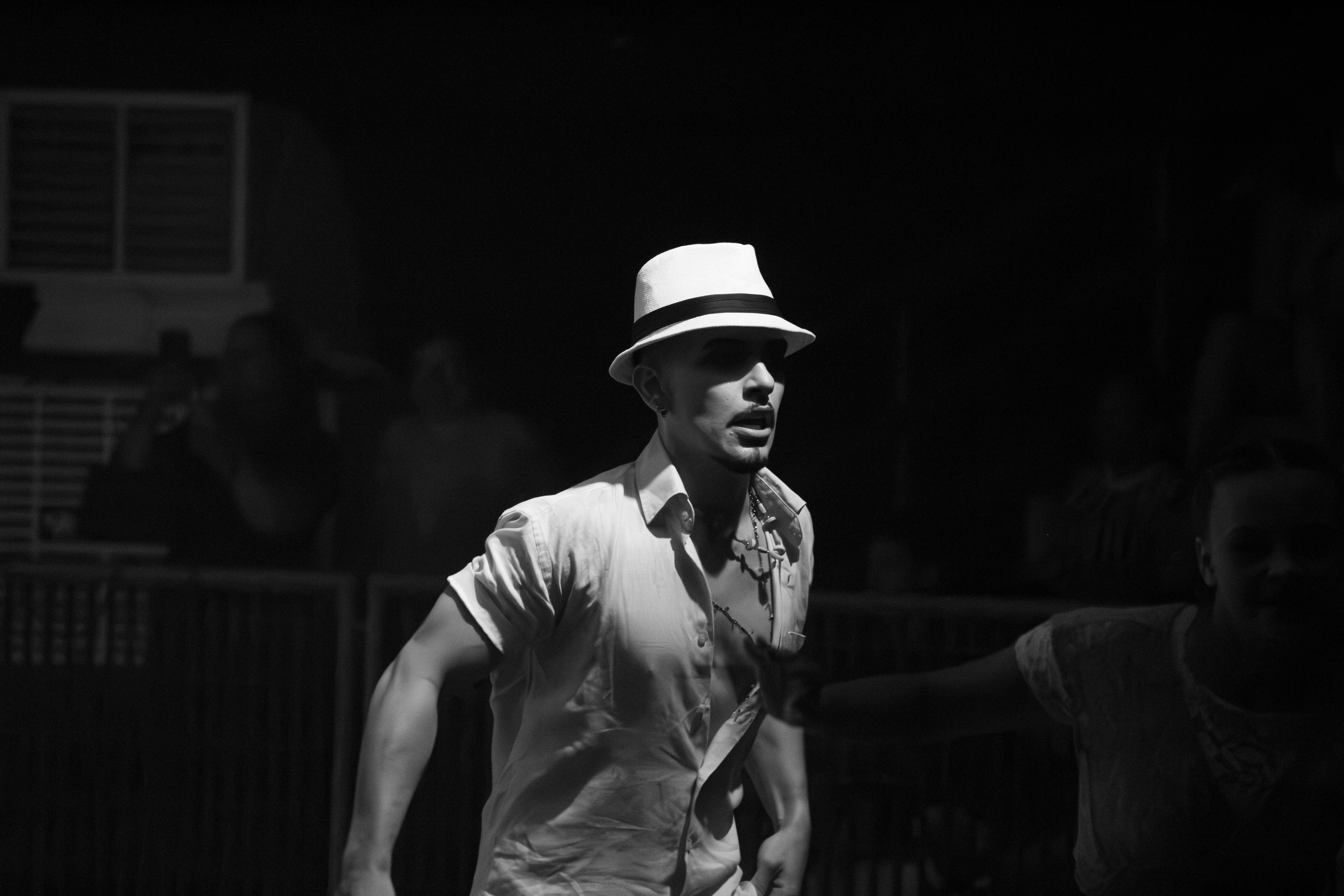 Midnight Serenade: A Dapper Performer in Spotlight