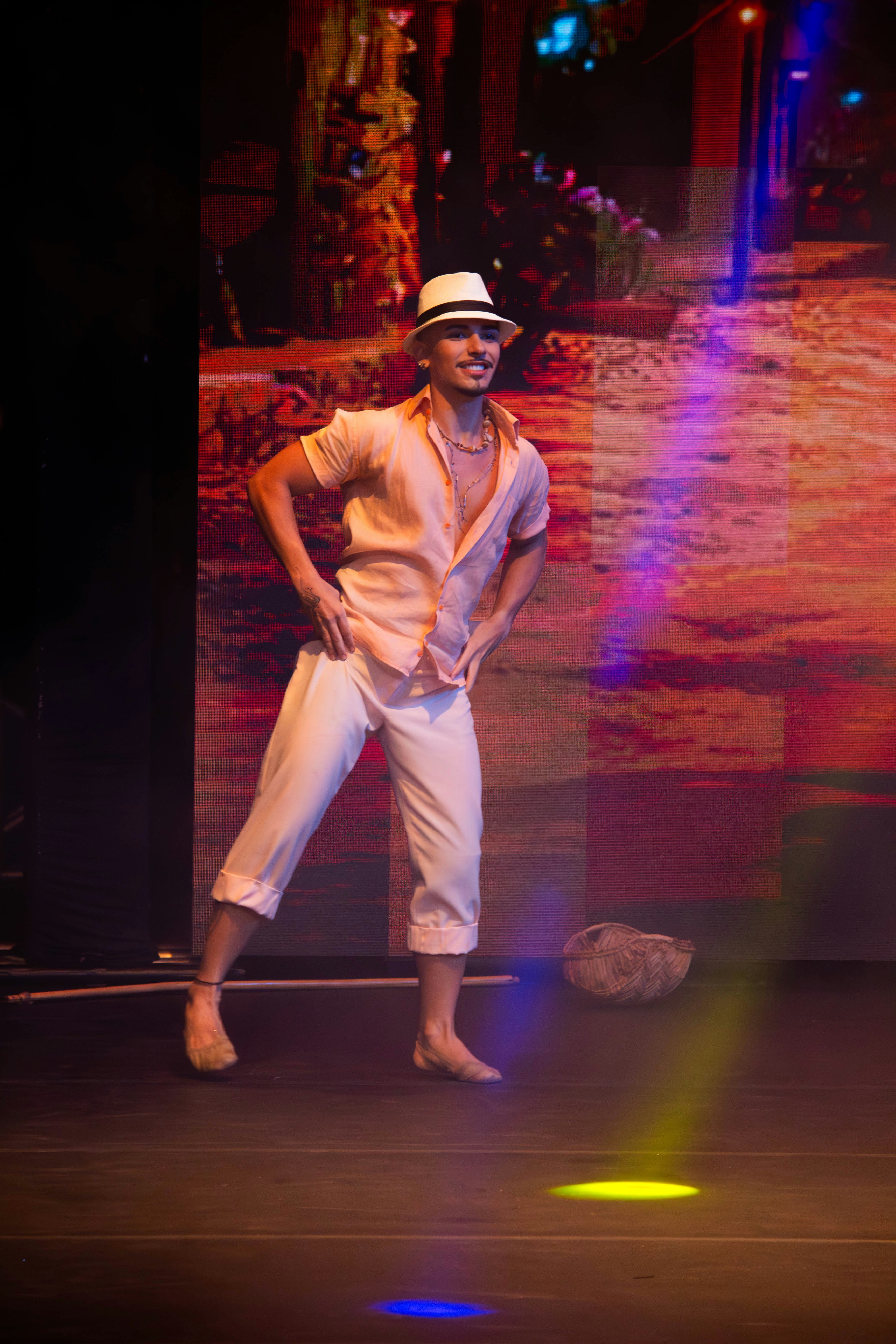 Sunlit Salsa: A Dapper Dancer Under Club Lights