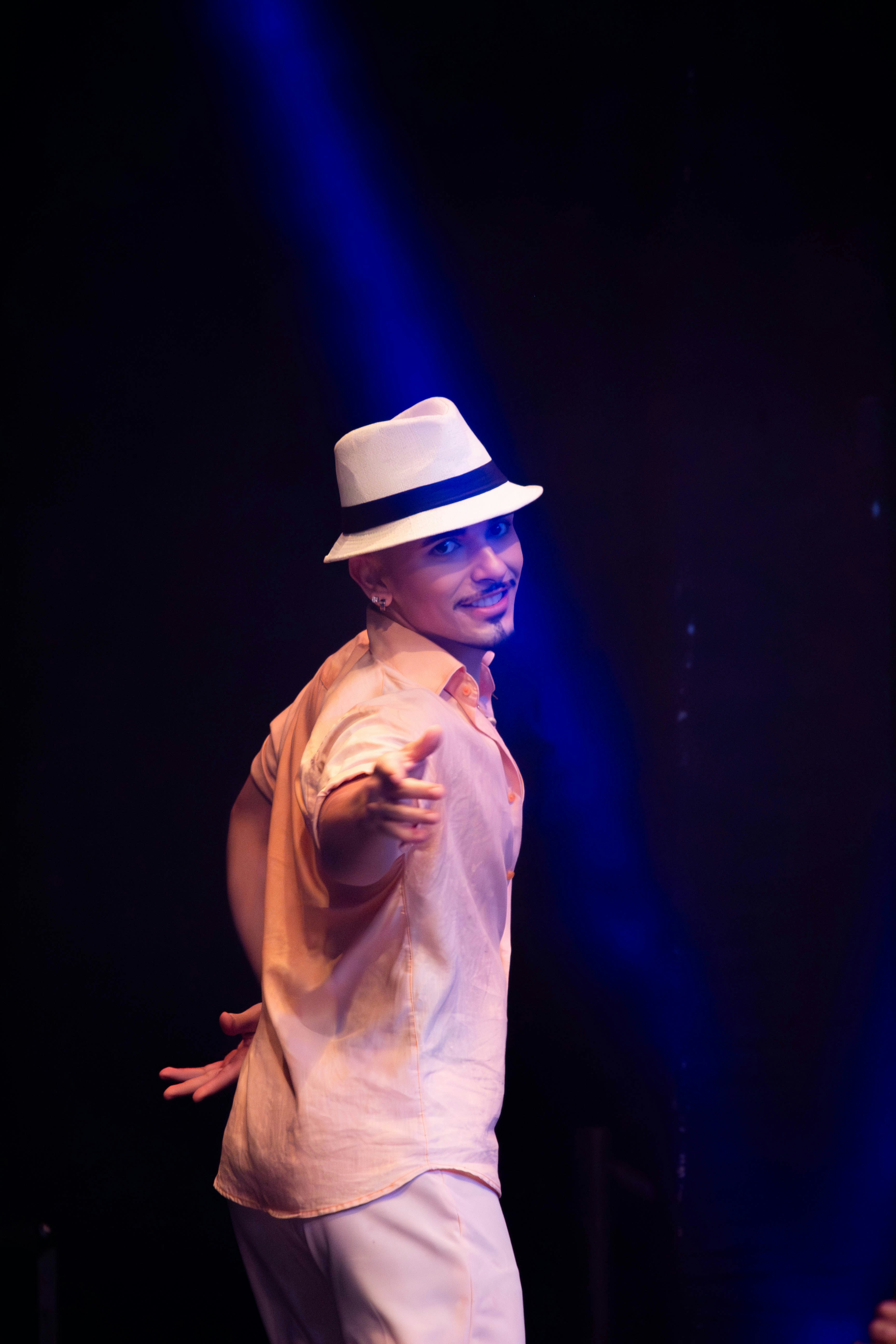 Stage Light Serenade: The Dapper Gambler in Spotlight