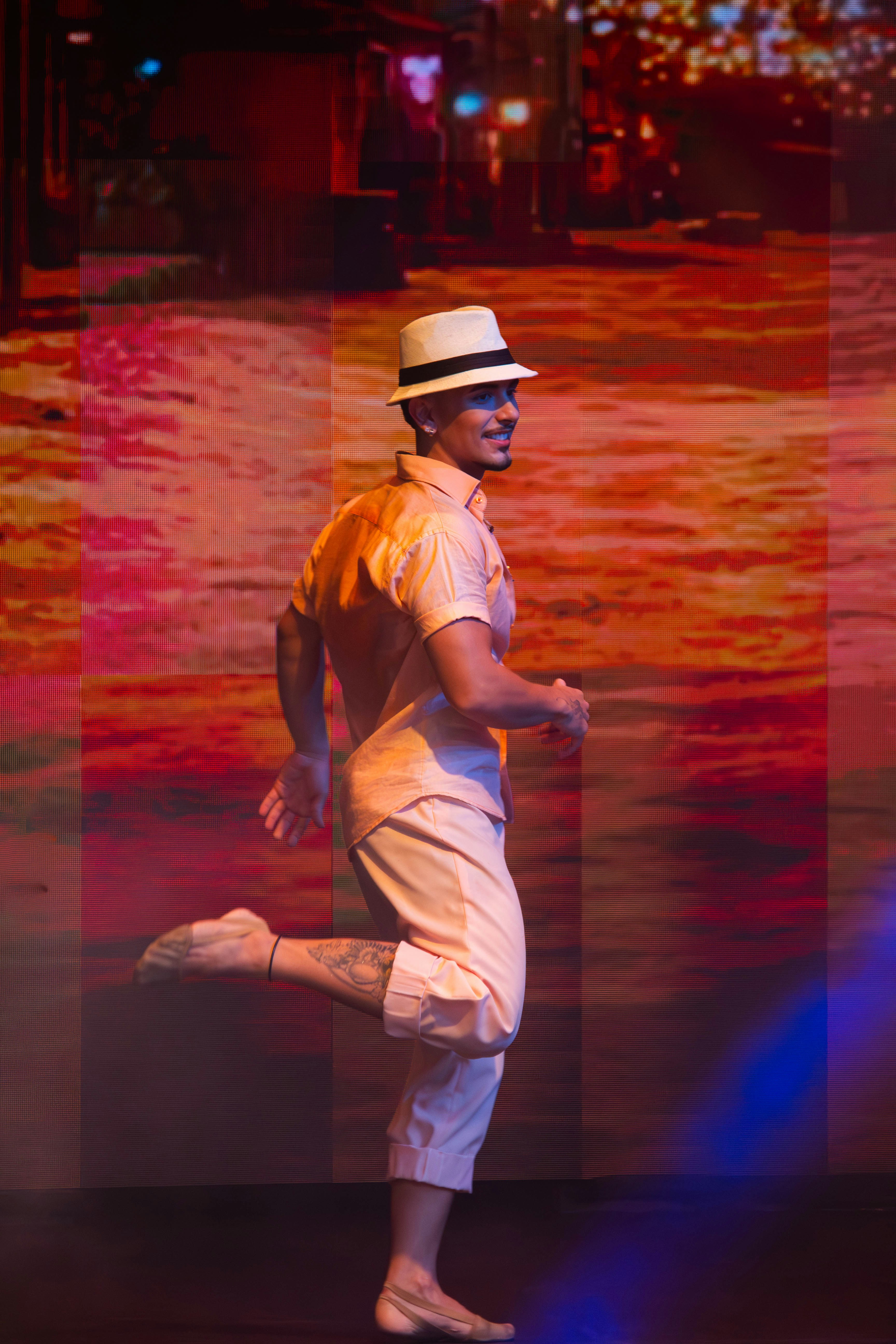 Mid-Jump in Neon Sands: Dapper Dancer in Sunset Club