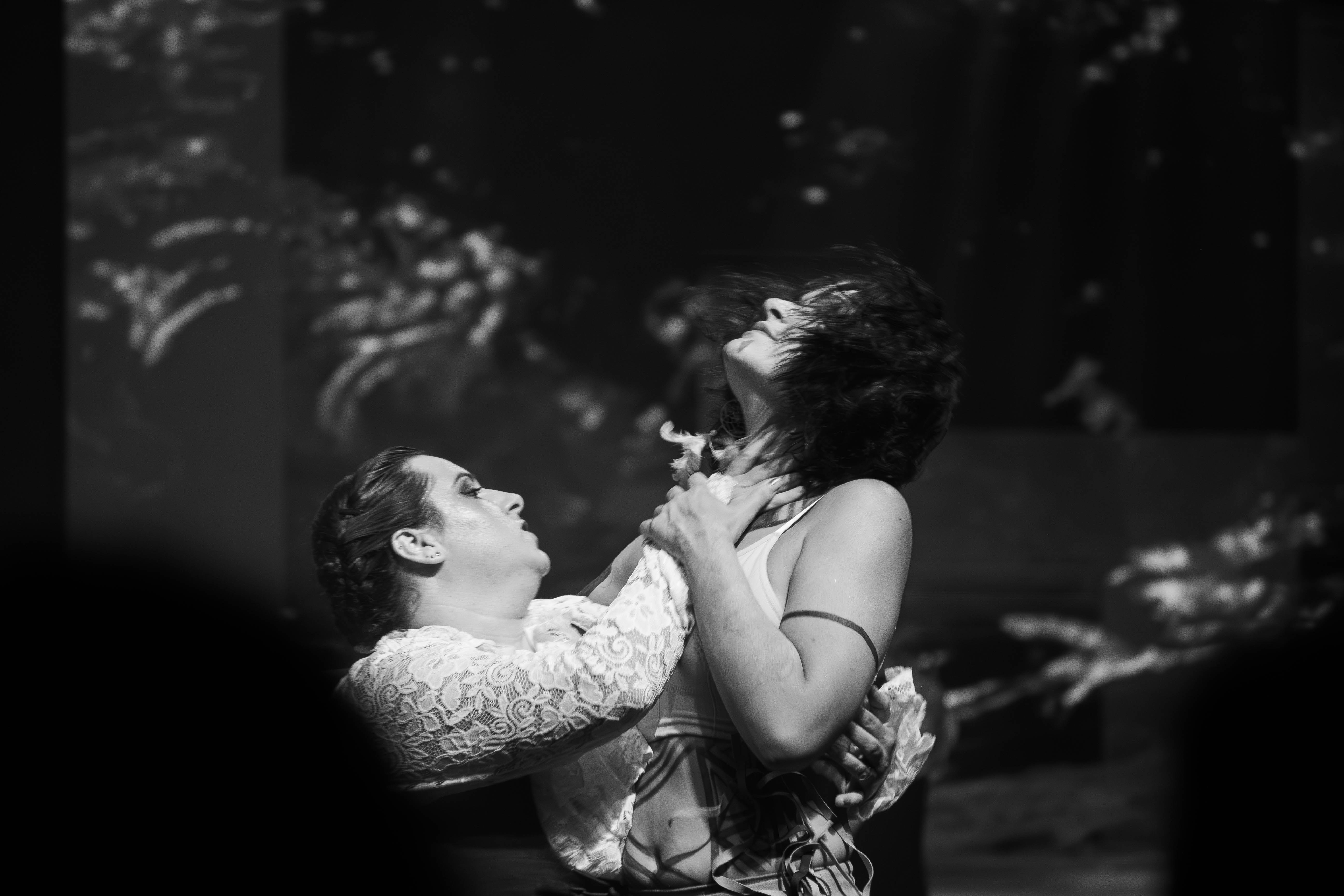 Lifted Moment: A Tender Embrace Under Stage Lights