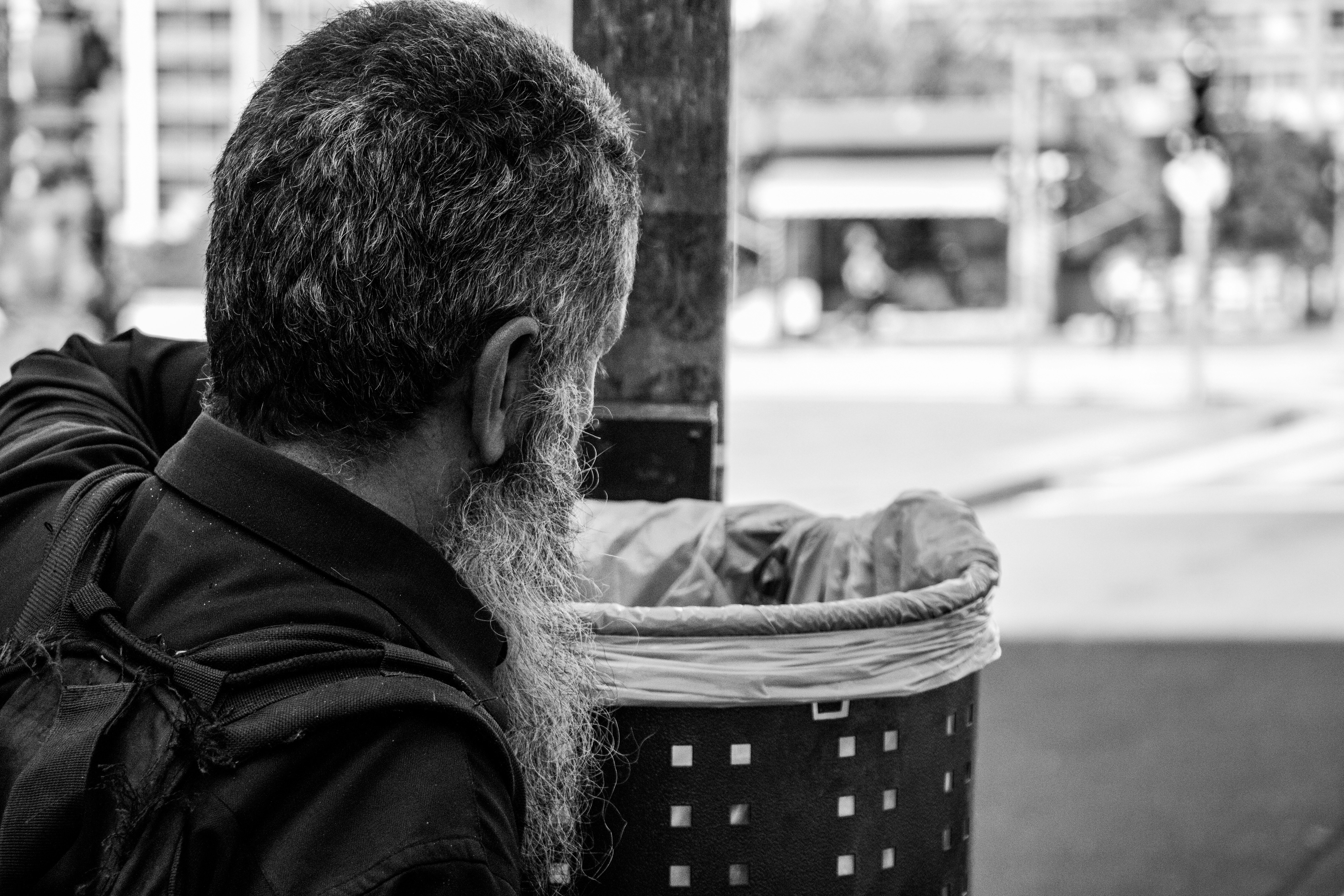 Weathered Watcher by the City Stop