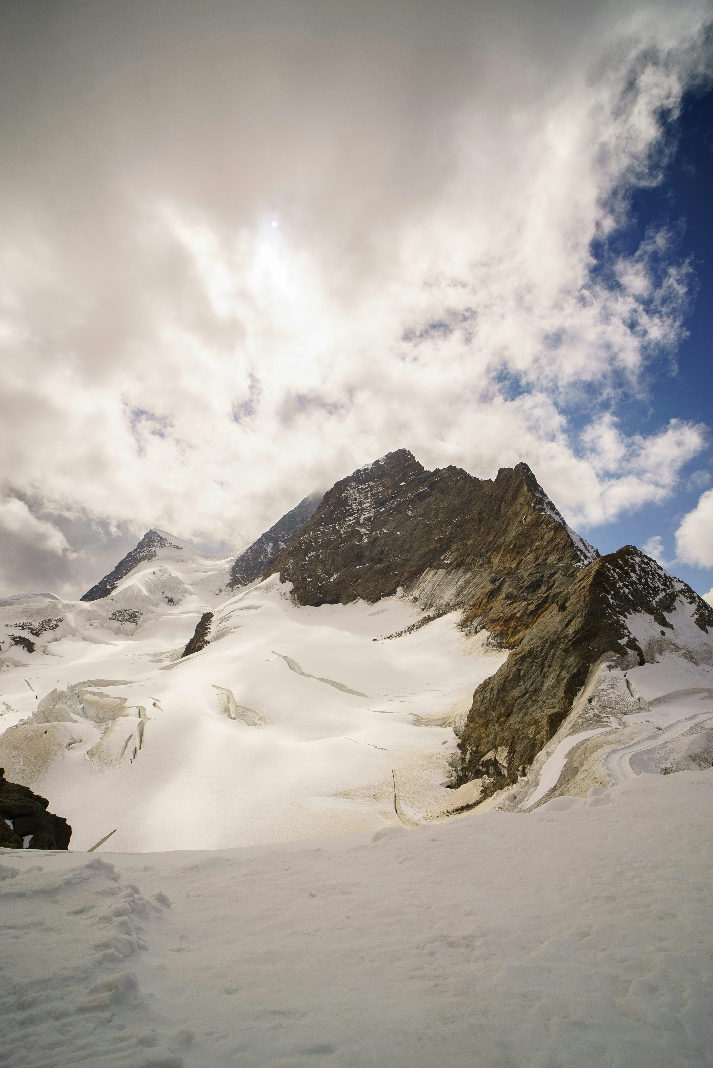 Snowbound Peak Under a Break in the Clouds