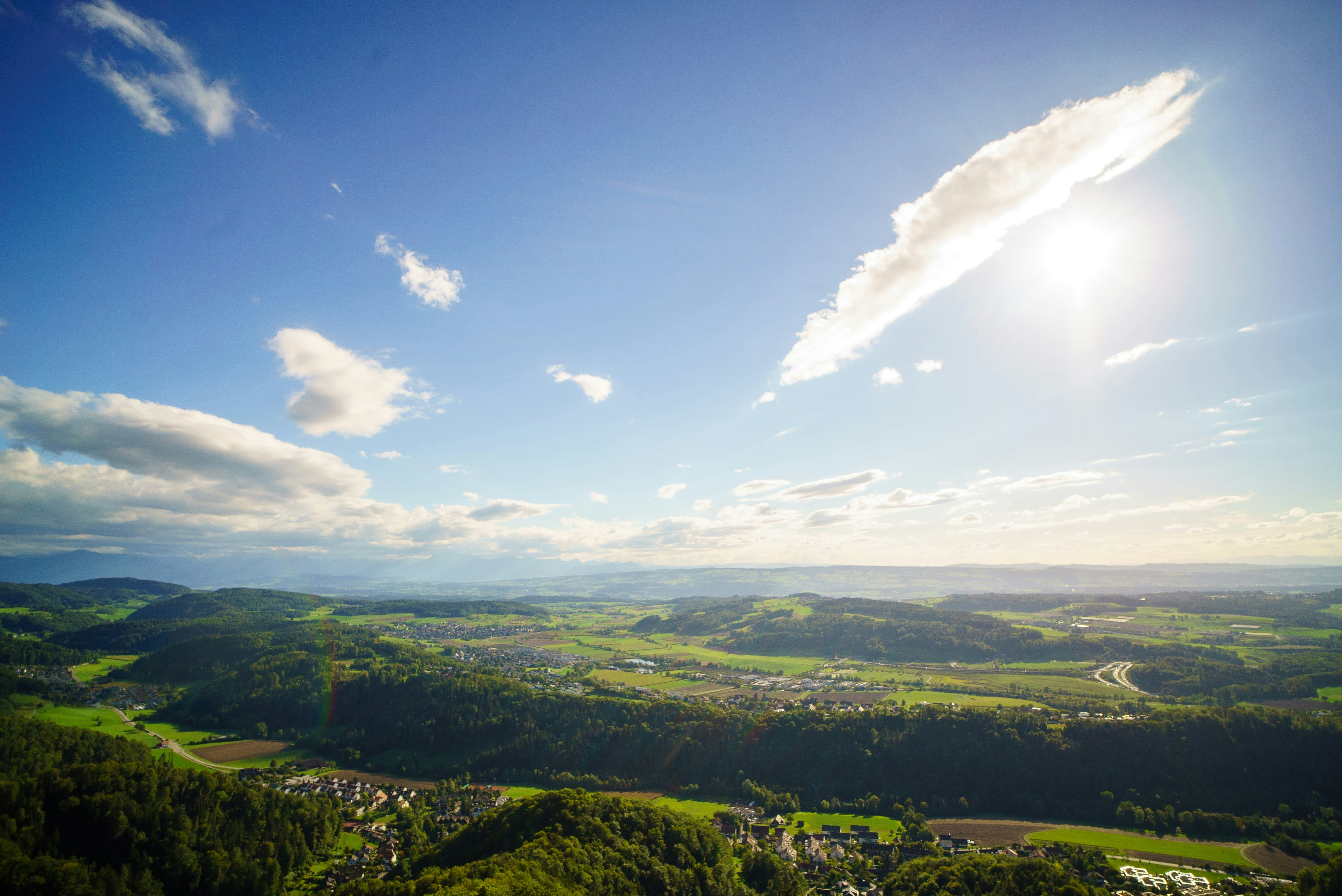 Rolling Hills Under a Tender Blue Sky