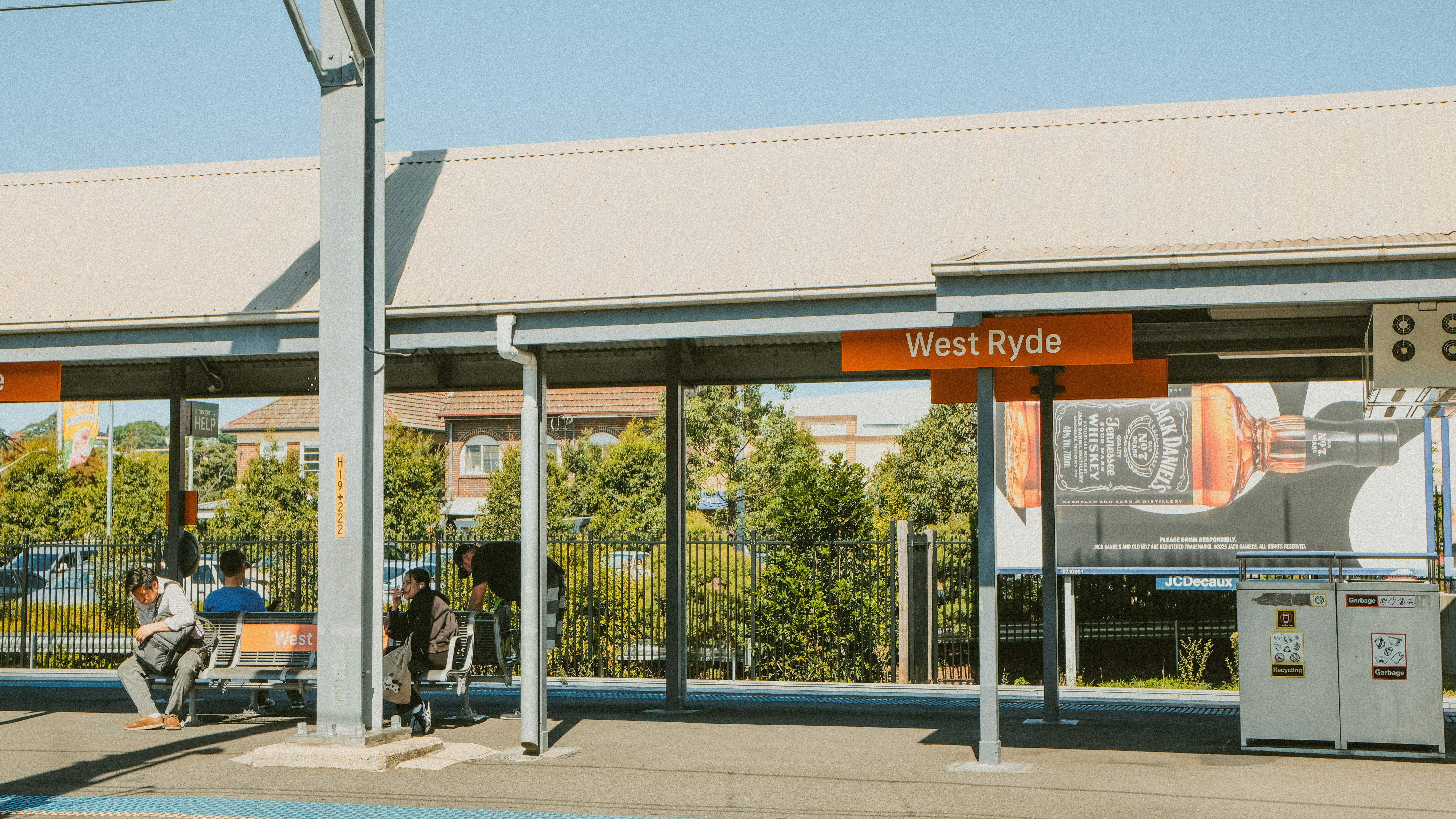 Quiet Platform at West Ryde: Morning commuters in a sunlit station