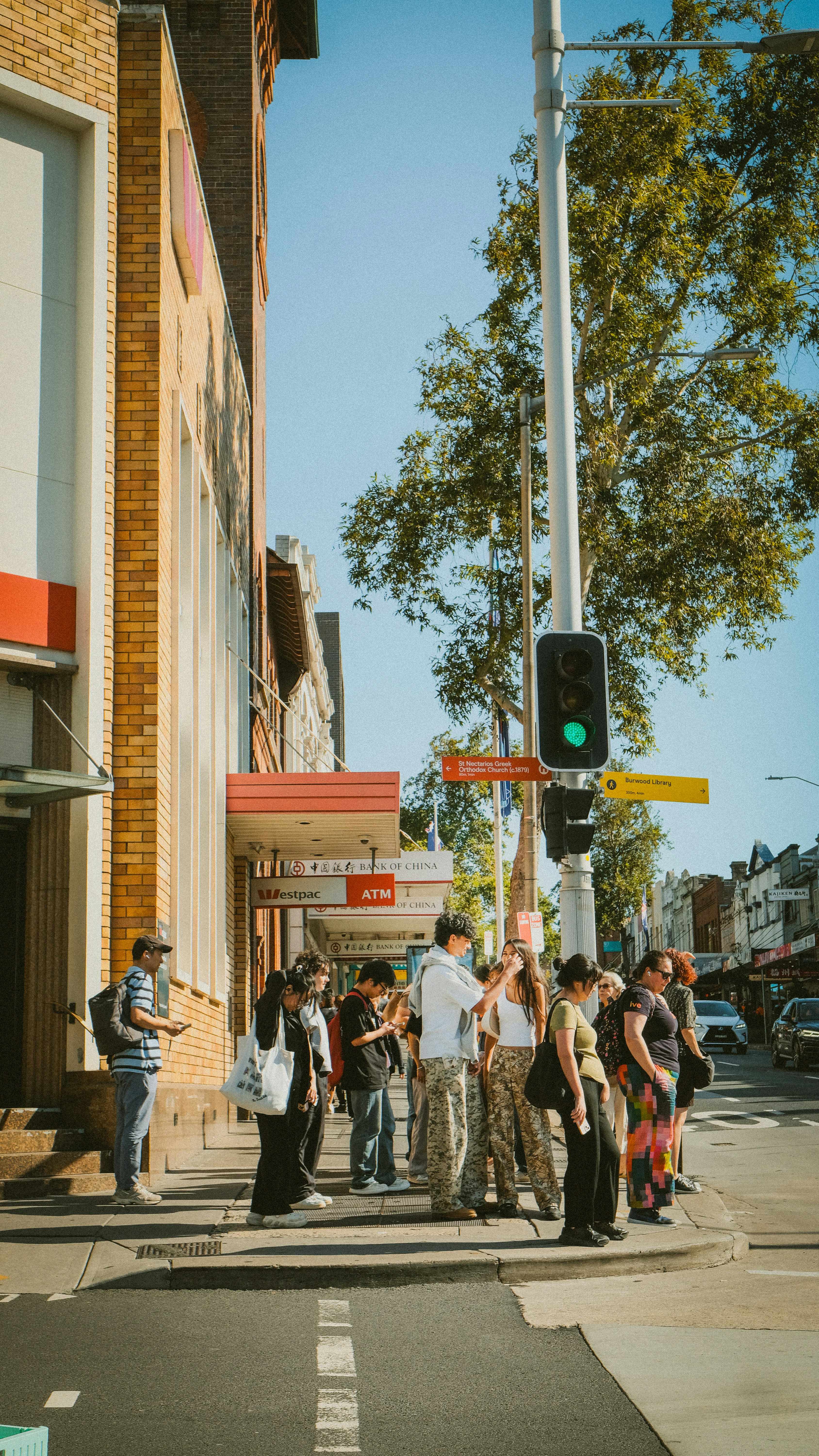 Crosswalk Convergence: A City Corner Surrounded by People