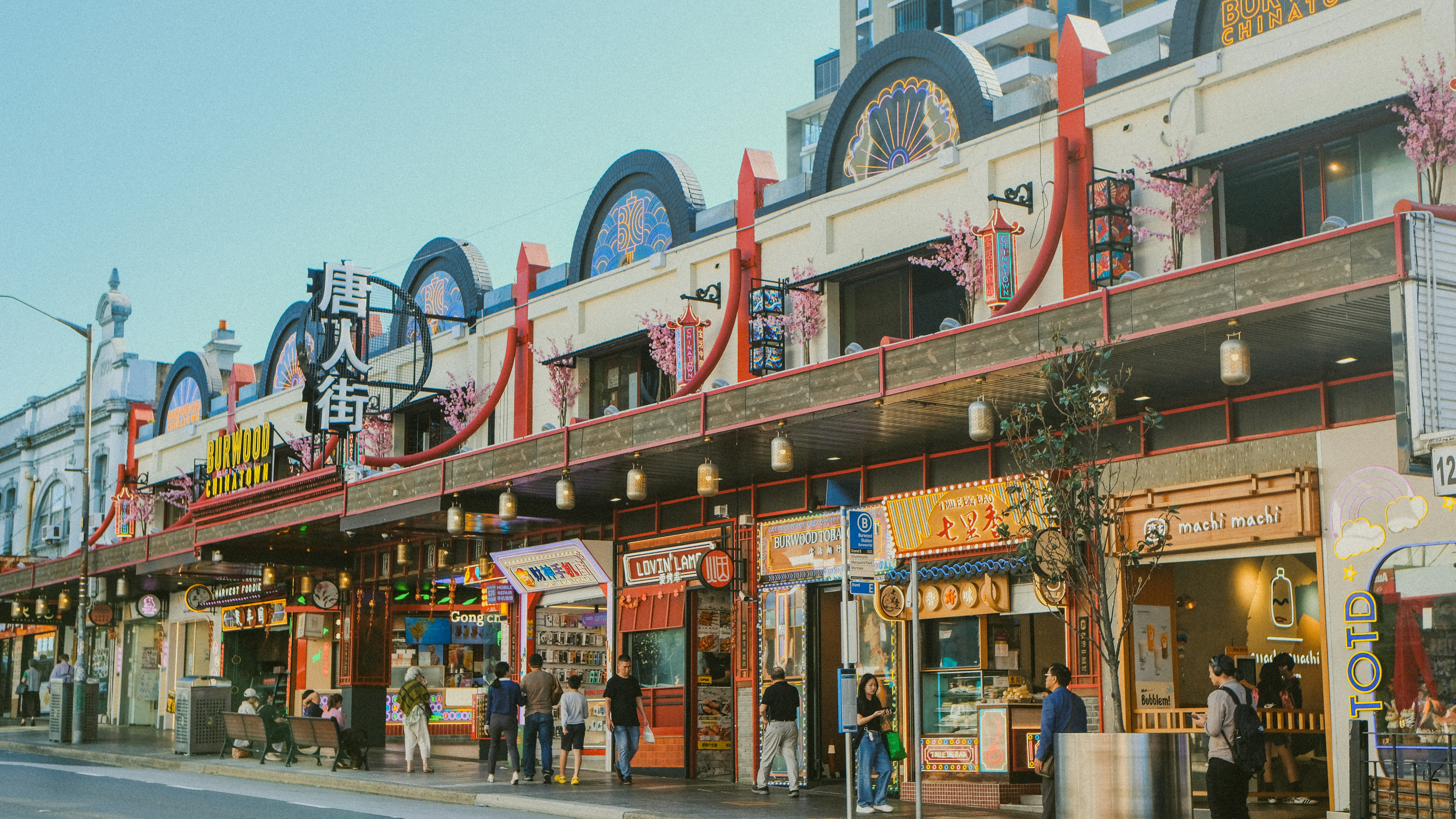 Neon Arcades and Streetfronts: A Bustling Transit of Color