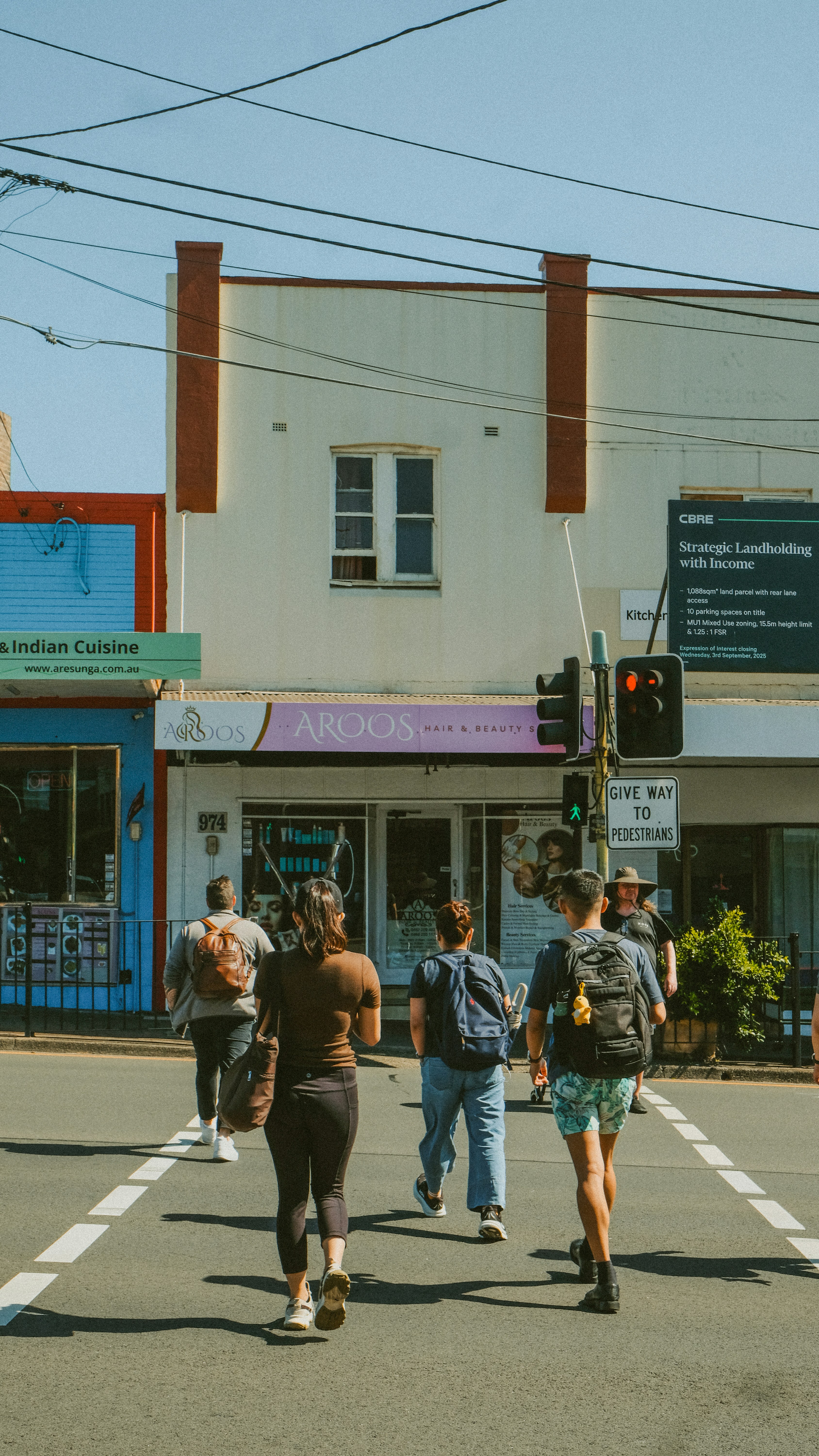 Crosswalk Convergence: Travelers Step into the Daylight