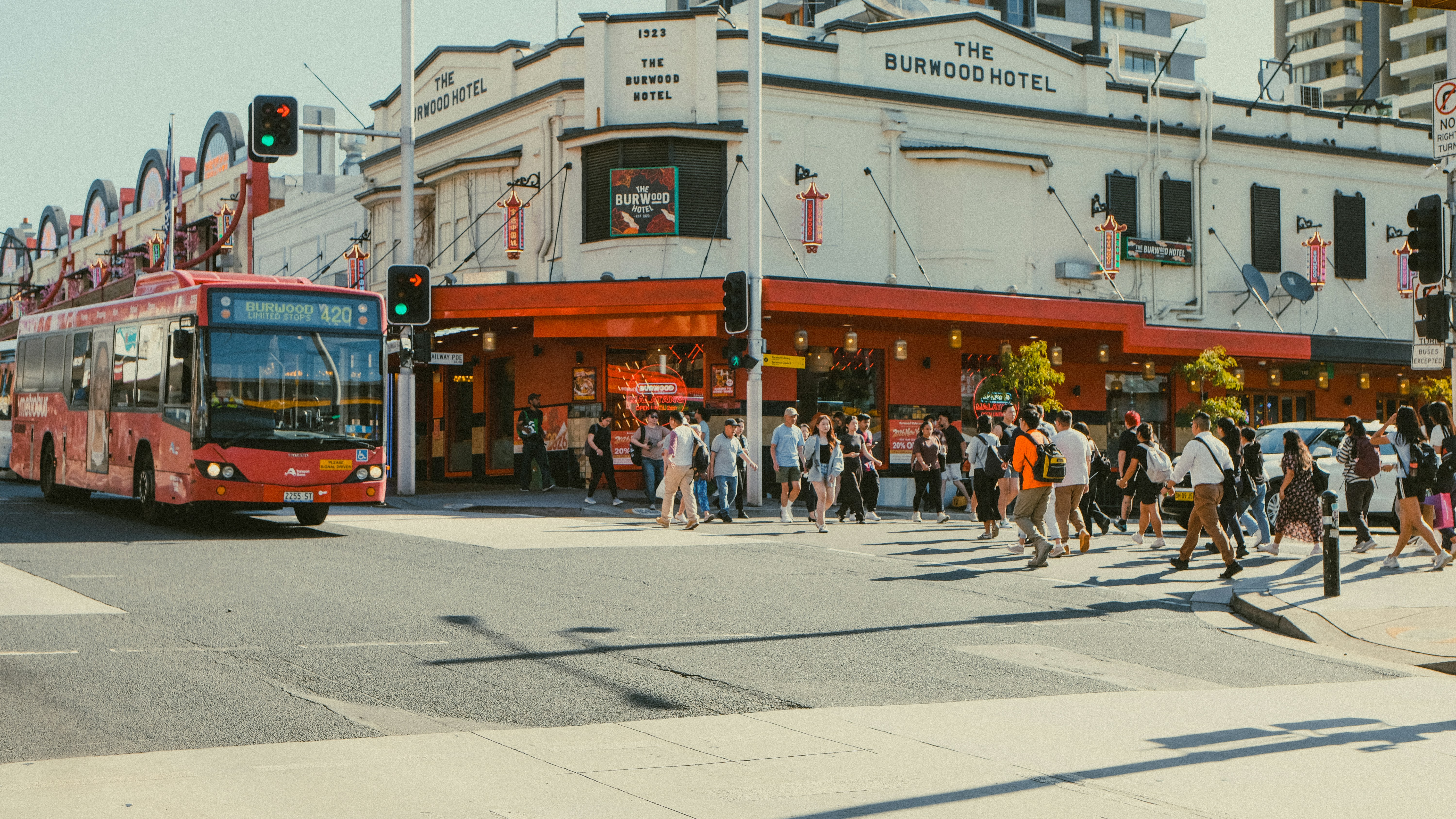 Crosswalk Rush at The Burwood: City Life by the Hotel