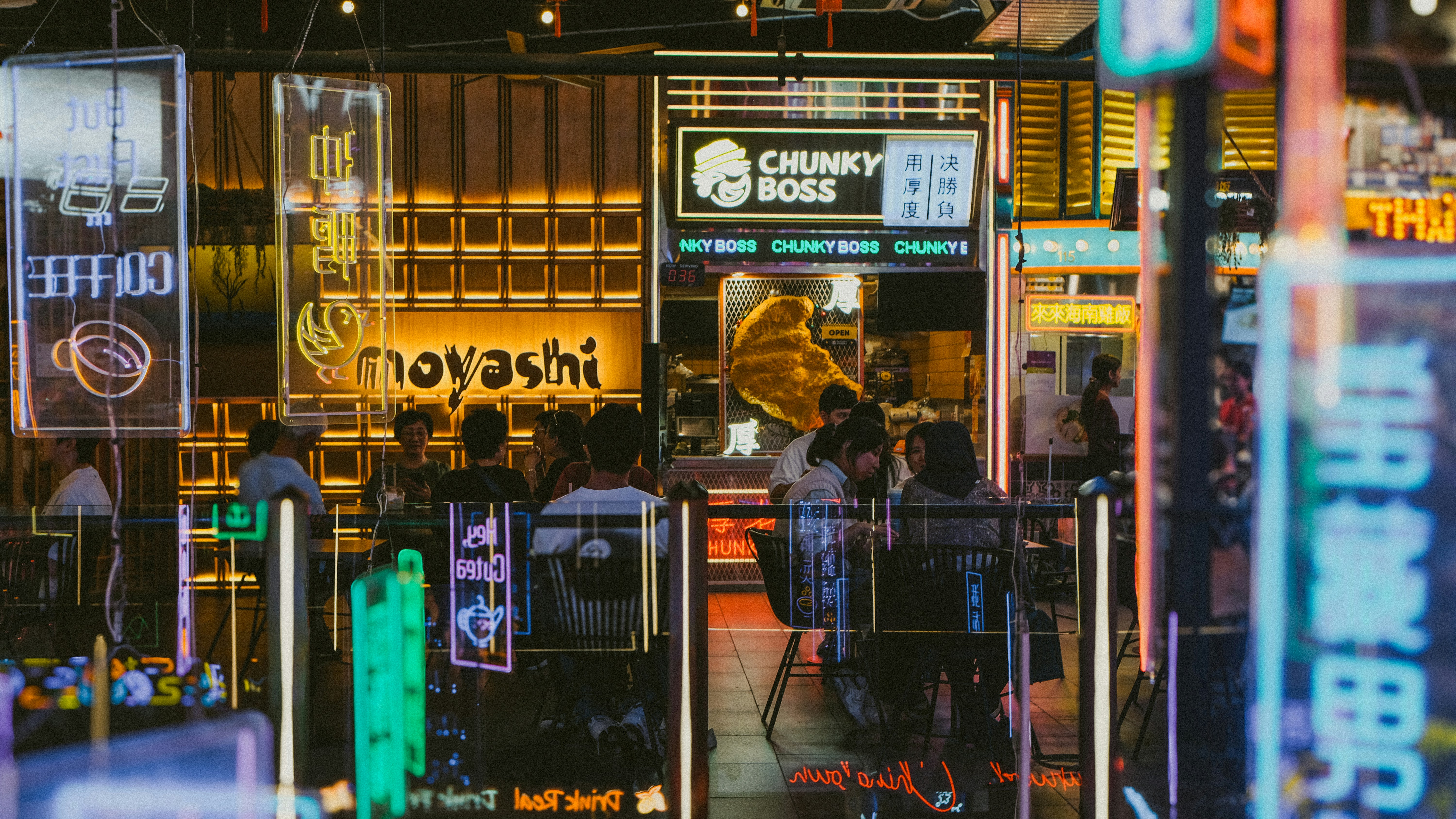 Neon-lit Bistro Pulse: A Glimpse into an Urban Café Crowd