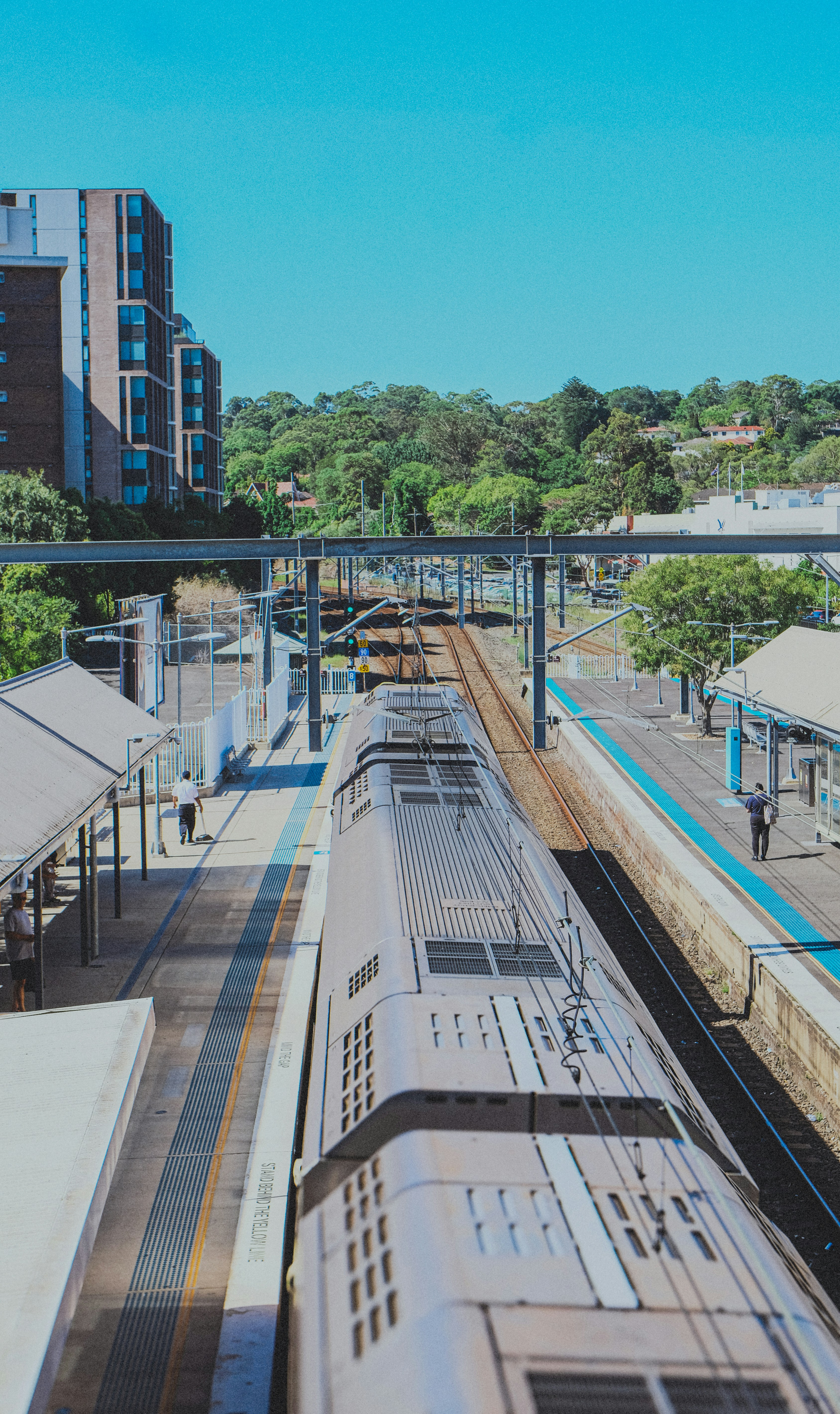 From Platform to Horizon: A Serpentine Rail Cut by a High-Cangled Train