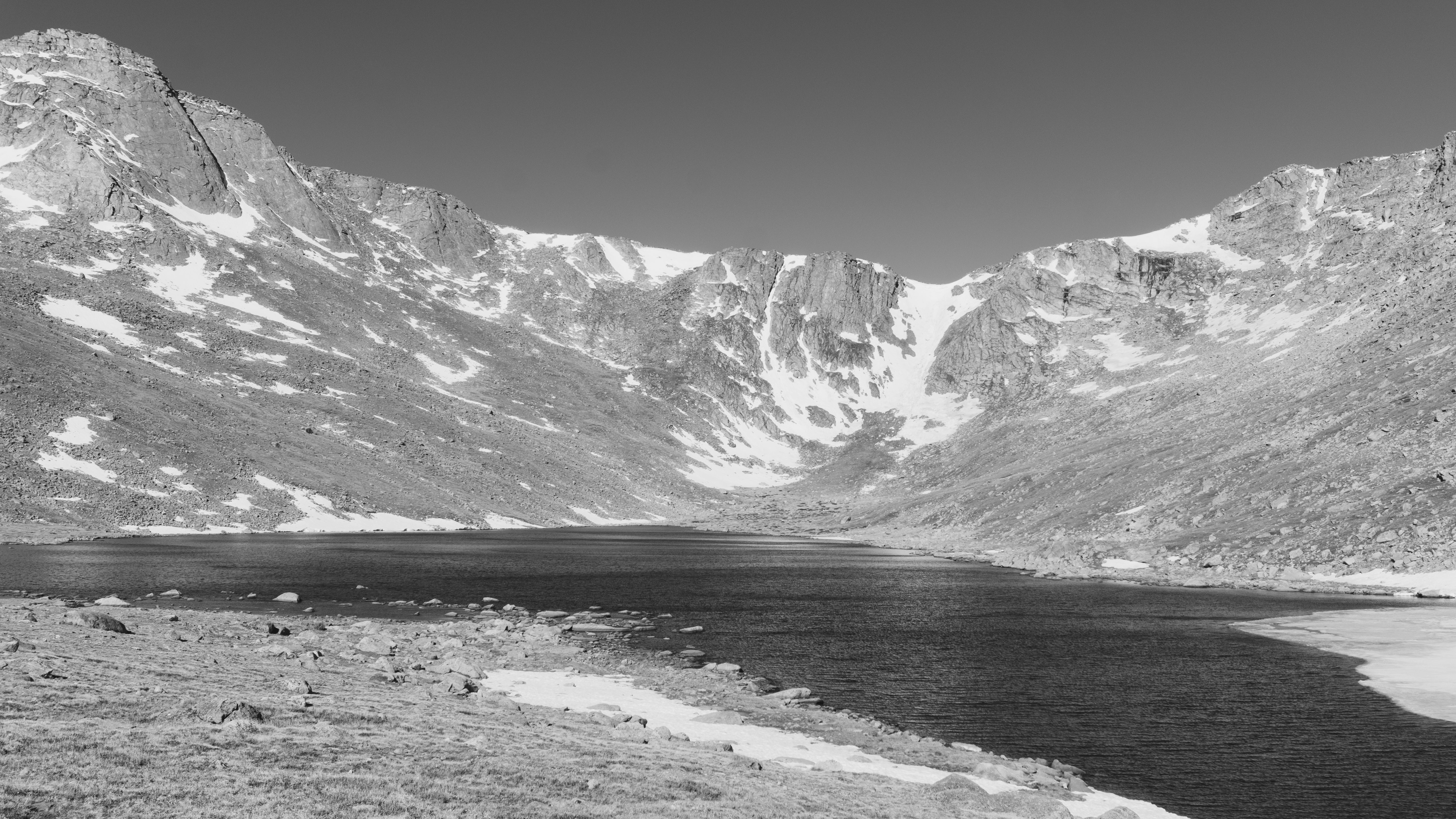 Glacial Amphitheater: A Monochrome Silent Basin Between Snowbound Cliffs