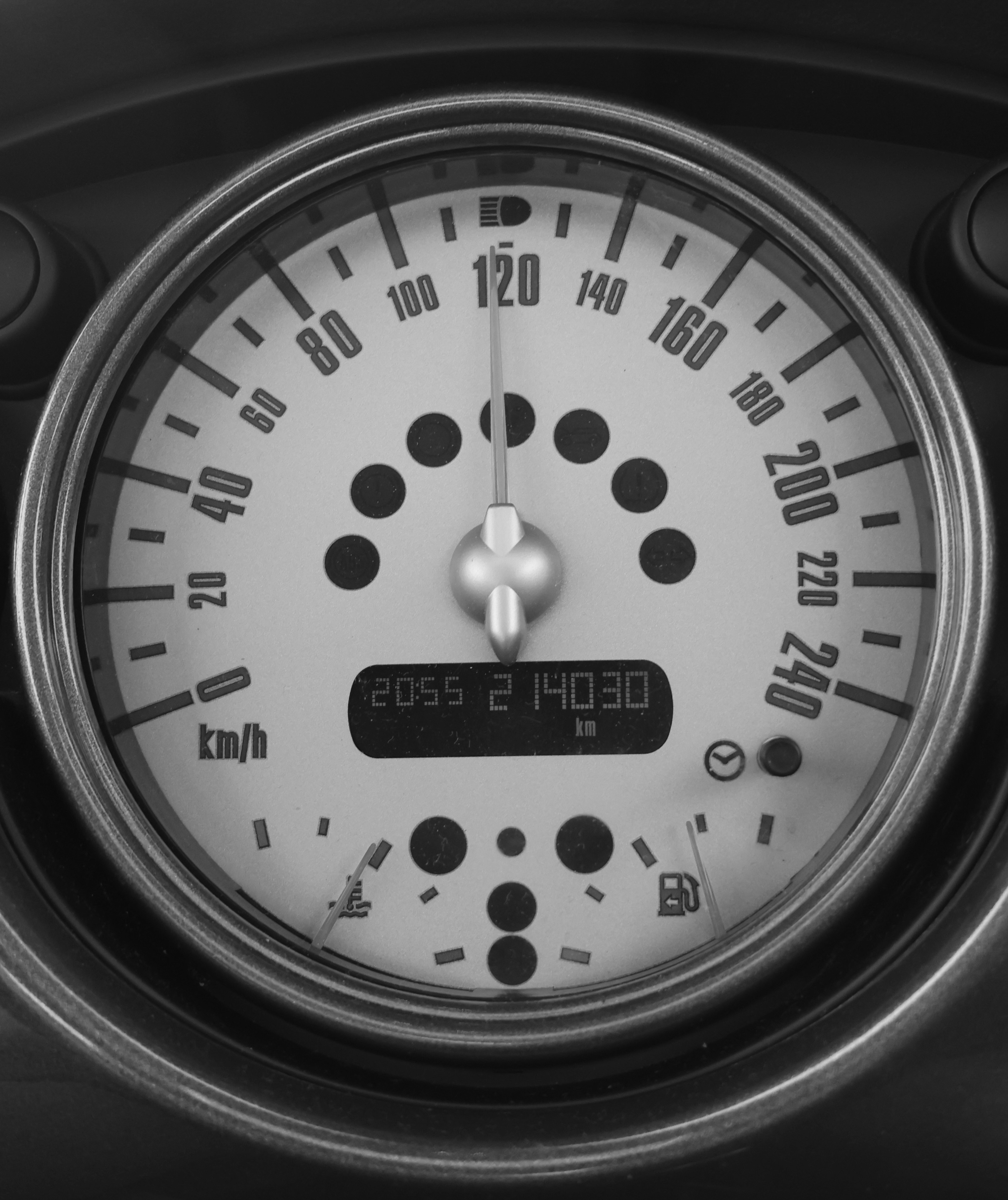 A black and white car speedometer and odometer.