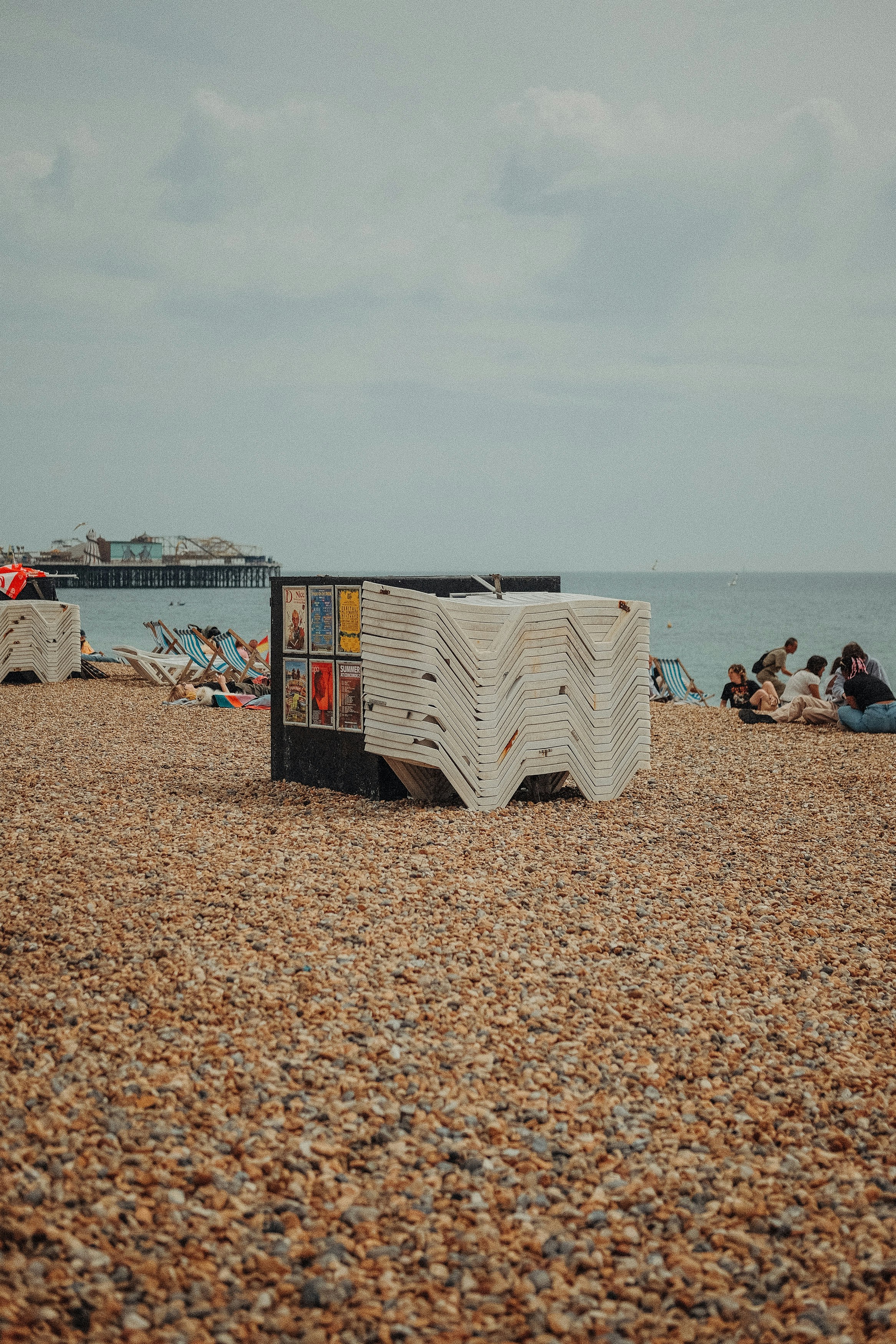 Stacked Beach Chairs at Quiet Sea Horizon