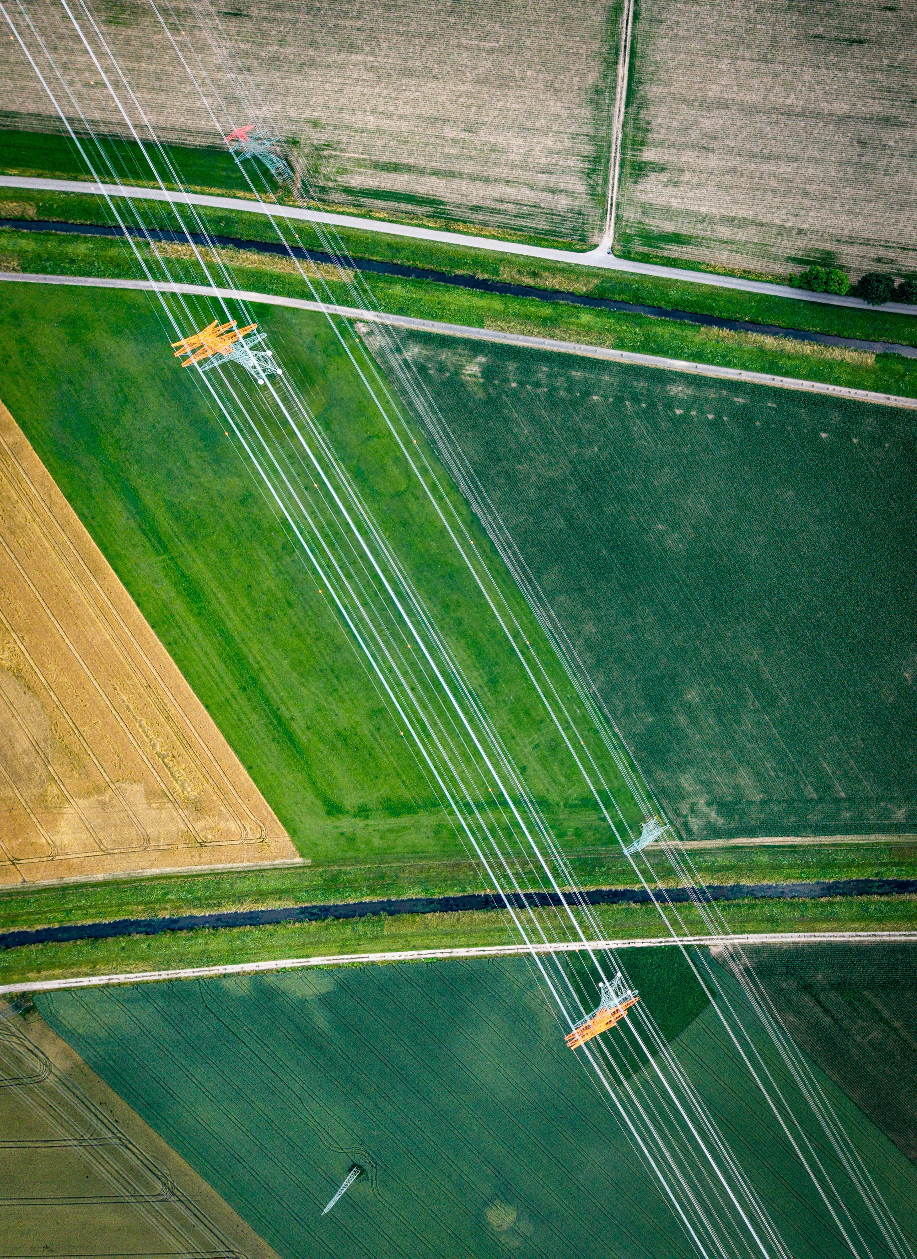 Coordinated Lines Across Field Parcels: An Aerial View of Power Corridor and Crops