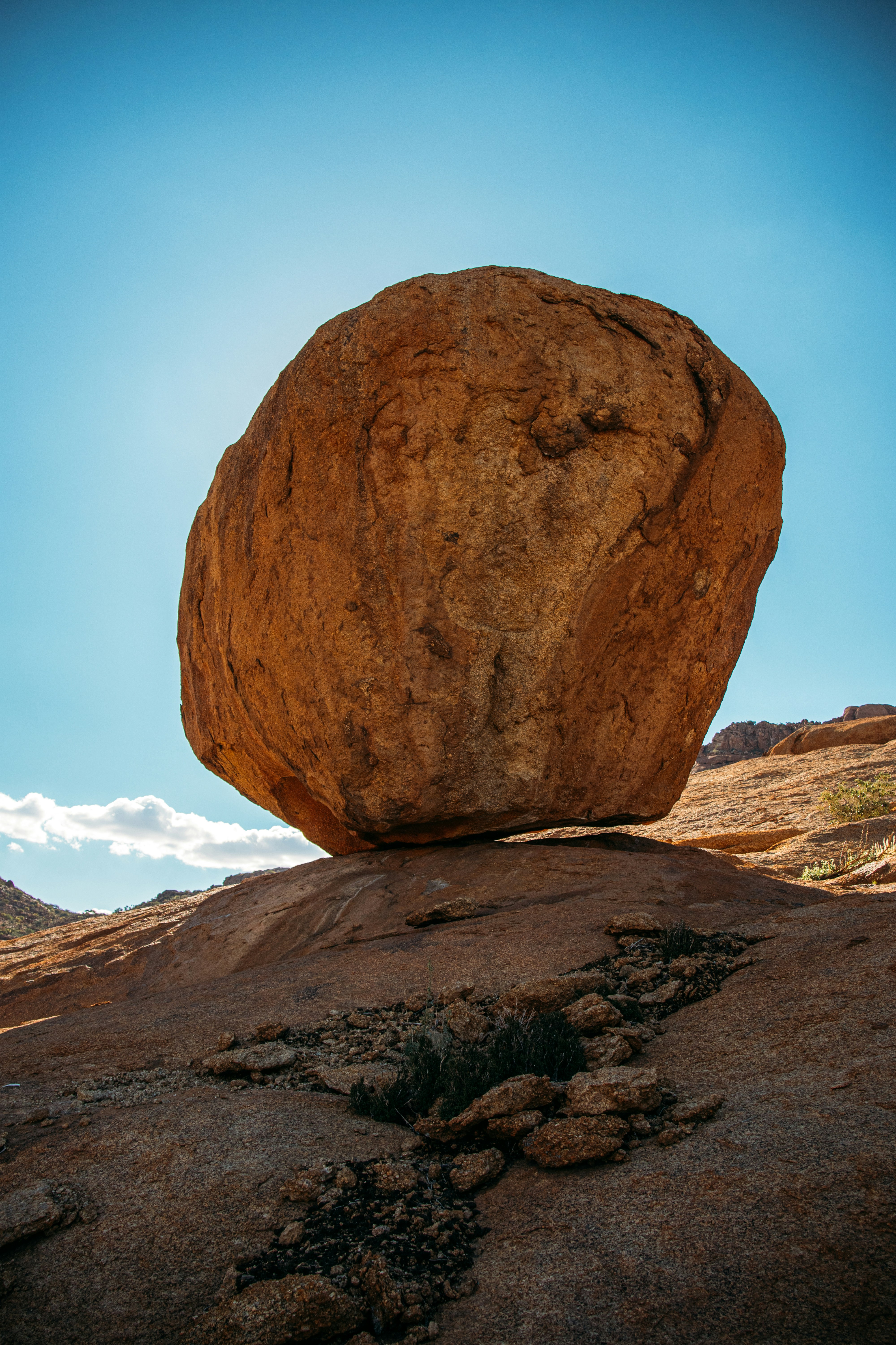 Balanced Gravity: A Gigantic Boulder Defies the Slope