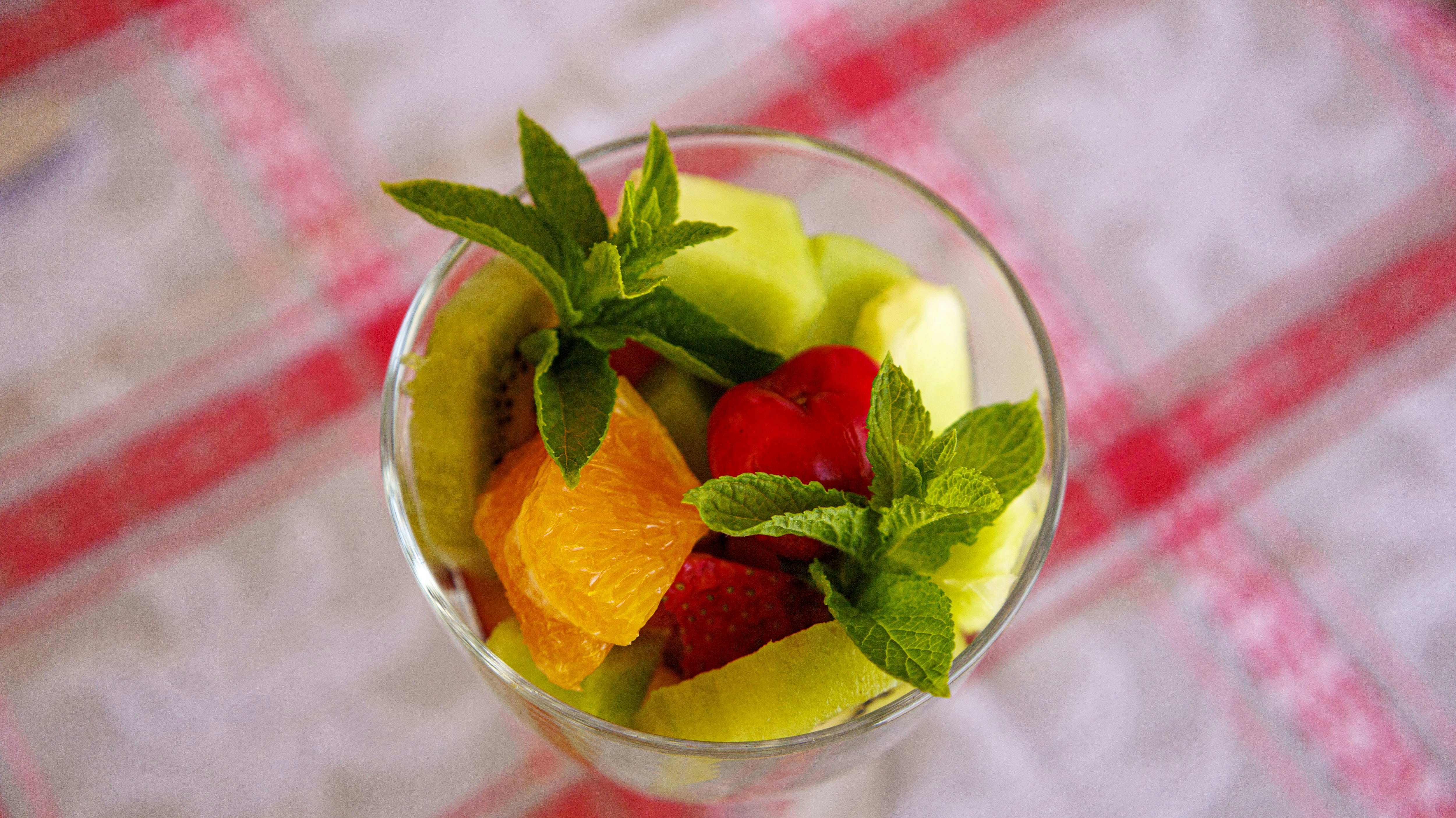 Citrus Symphony in a Glass: Fresh Fruit Crowned with Mint
