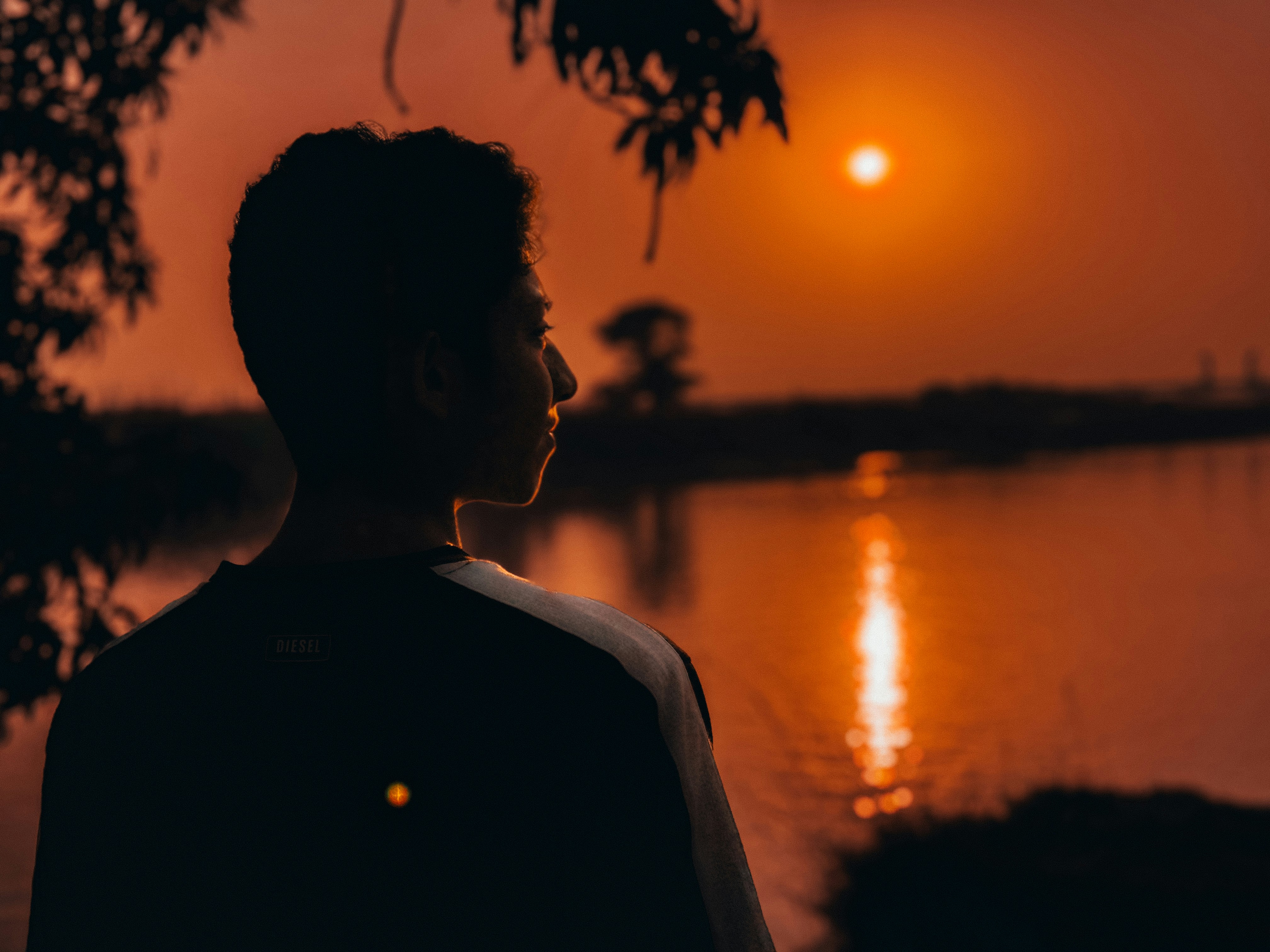 Sunset Silhouette: A Quiet Portrait by the Water