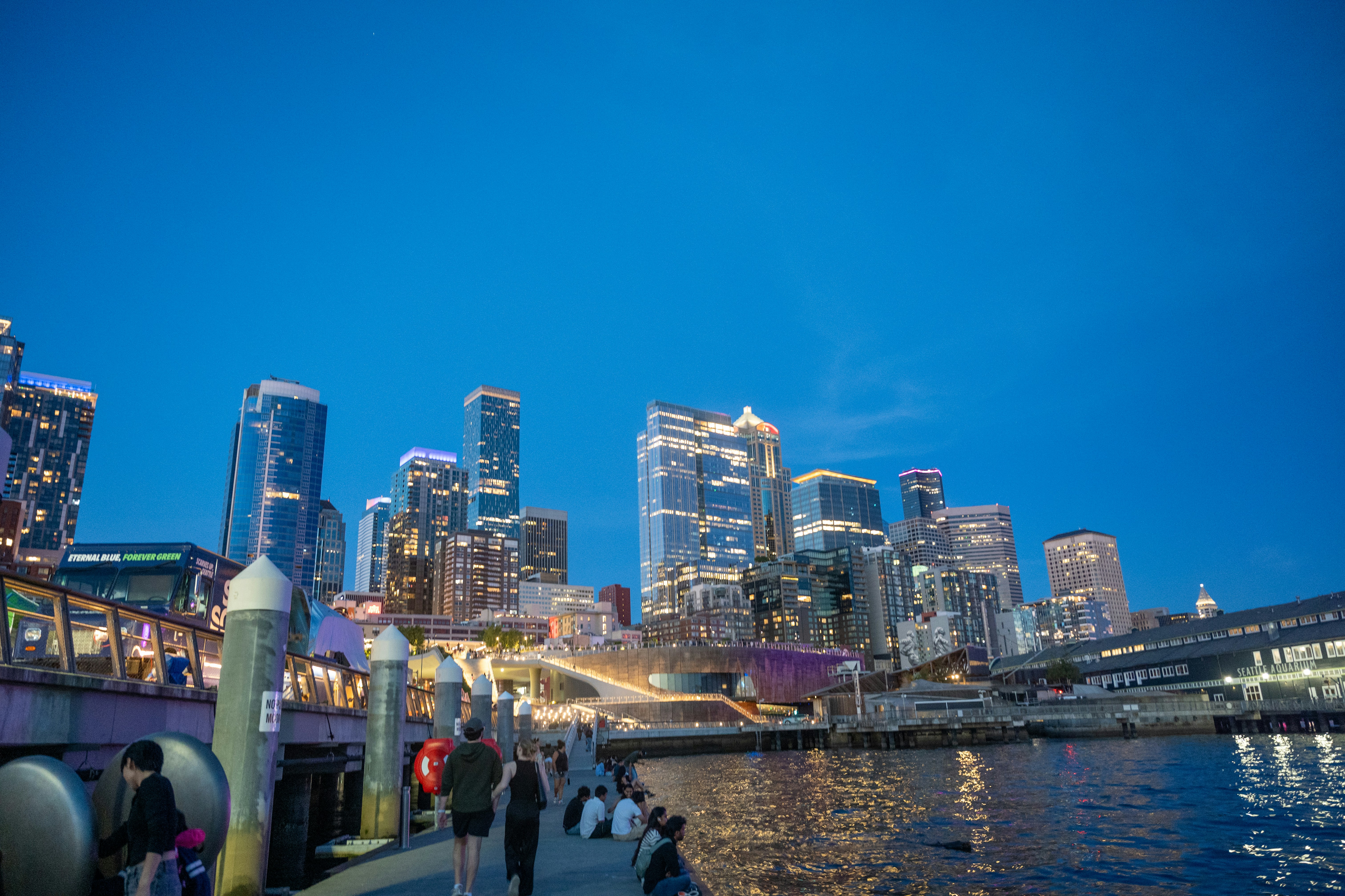 Harbor Promenade Beneath a Neon Skyscraper Sky