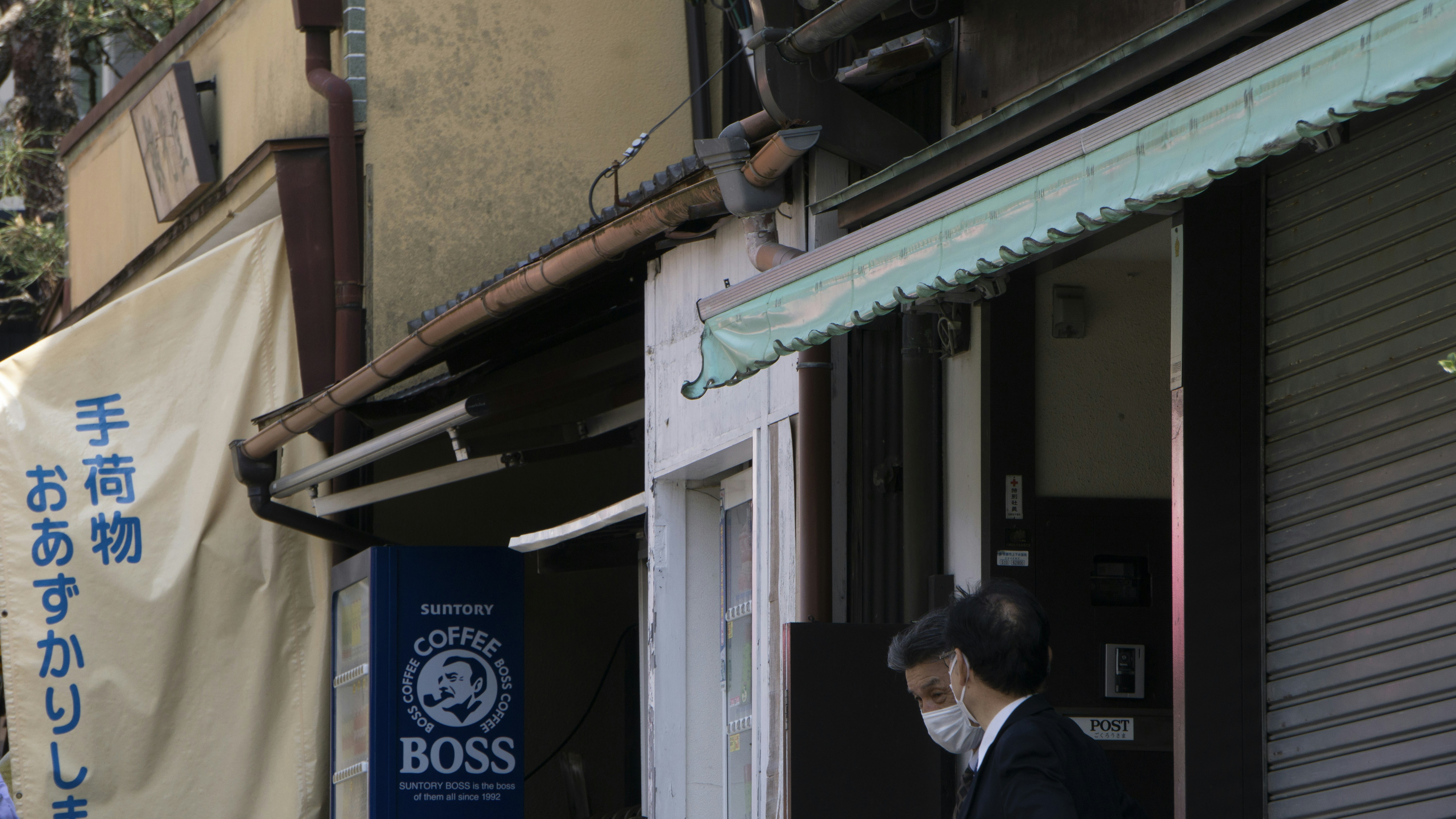 Muted Streetfront: A Quiet Moment Outside a Japanese Shopfront