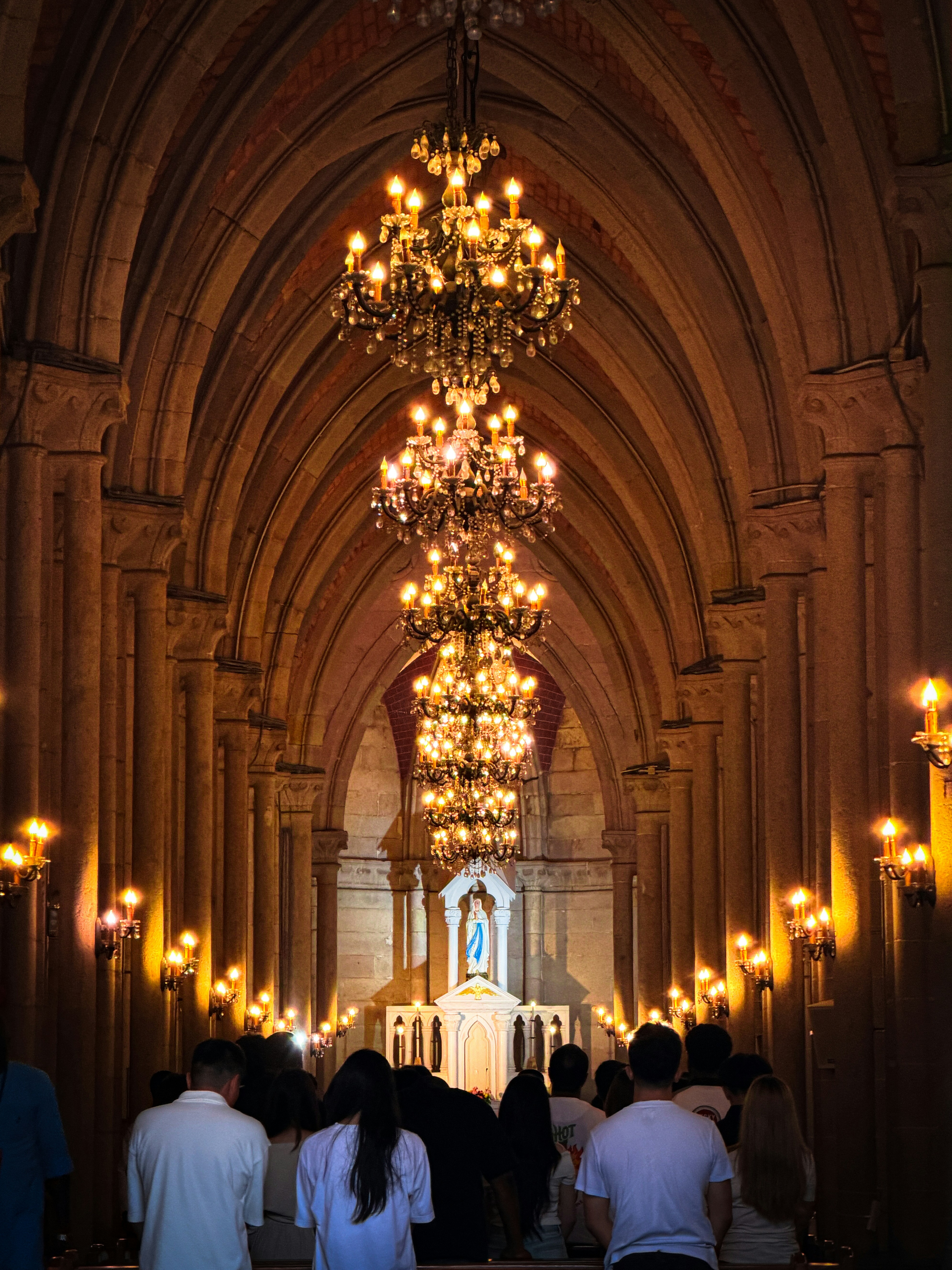 Chapel of Lanterns: A Marble Nave Illuminated by Chandeliers