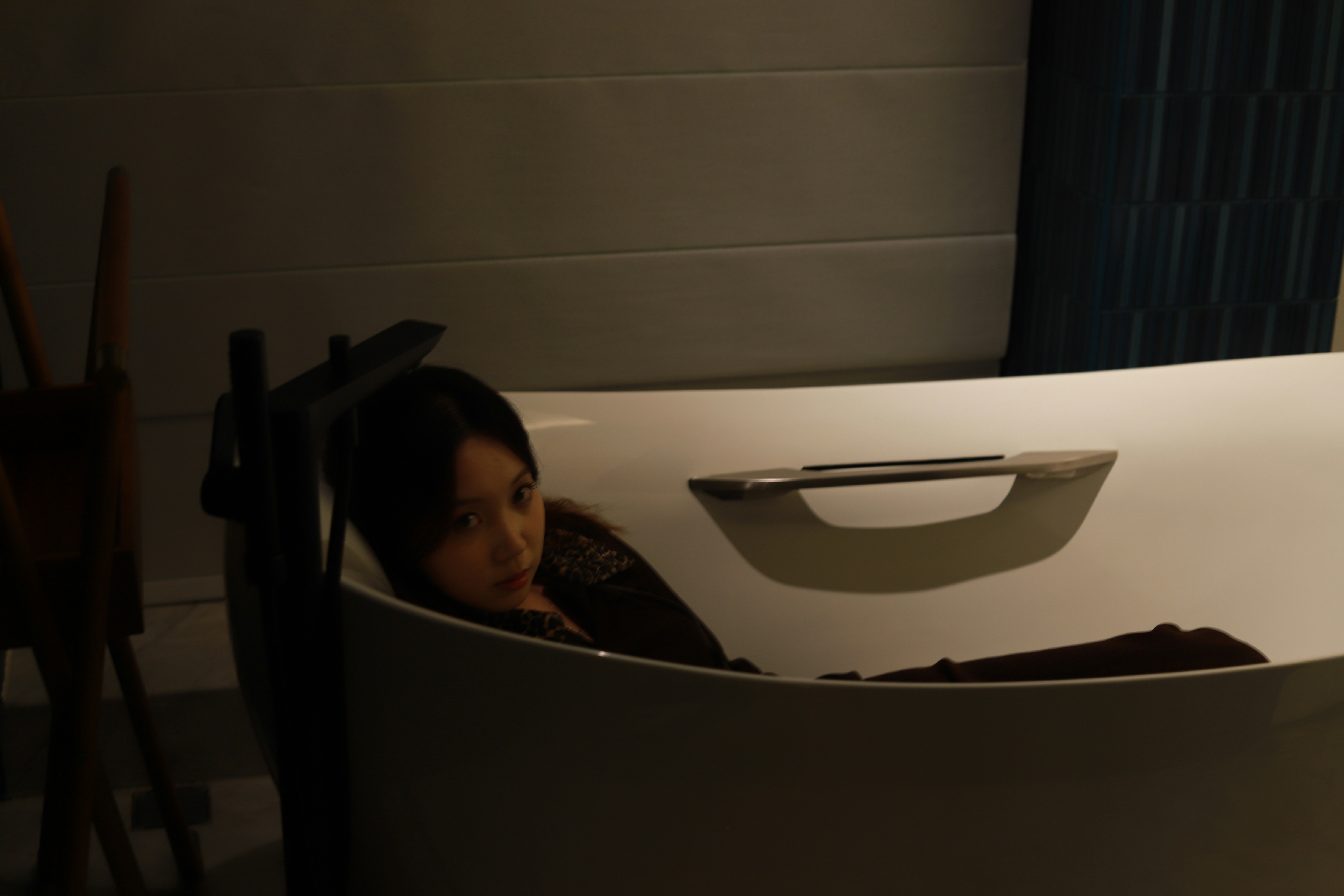 Moonlit Bath: Quiet Confinement in a White Studio Tub