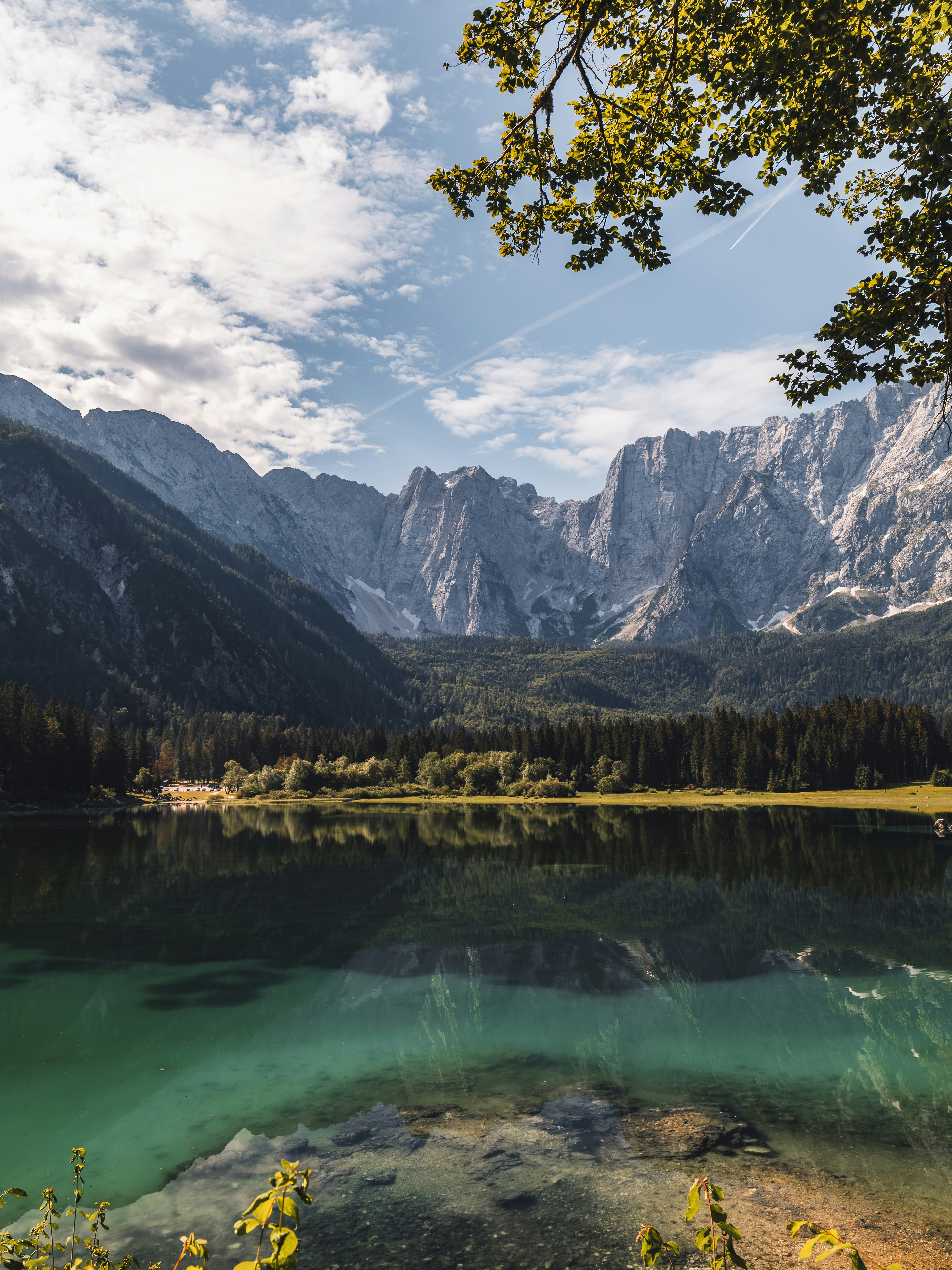 Emerald Mirror: Alpine Lake Reflecting Towering Peaks