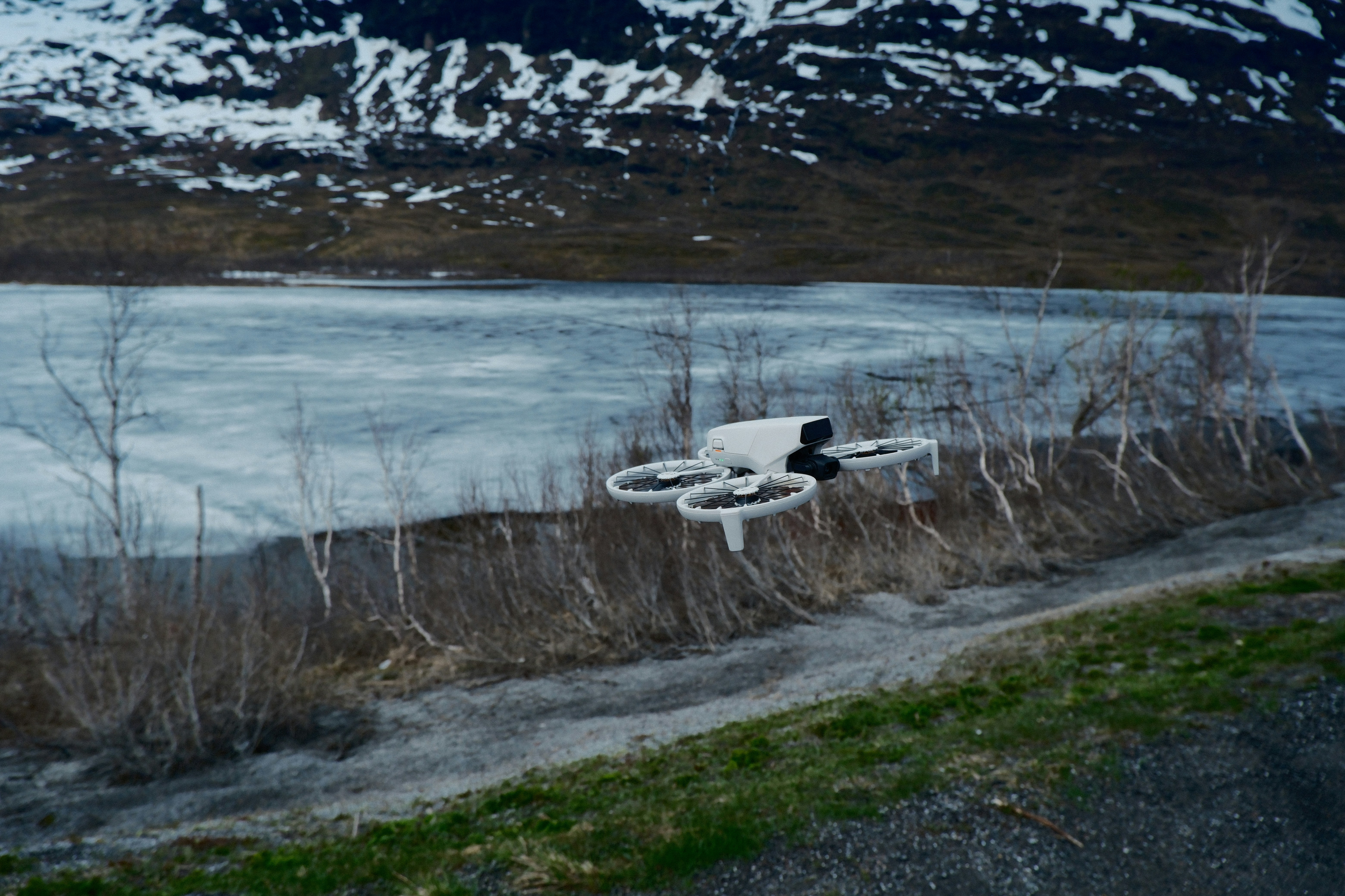 Autopilot Overlook: Droned Crossing by the Riverbank