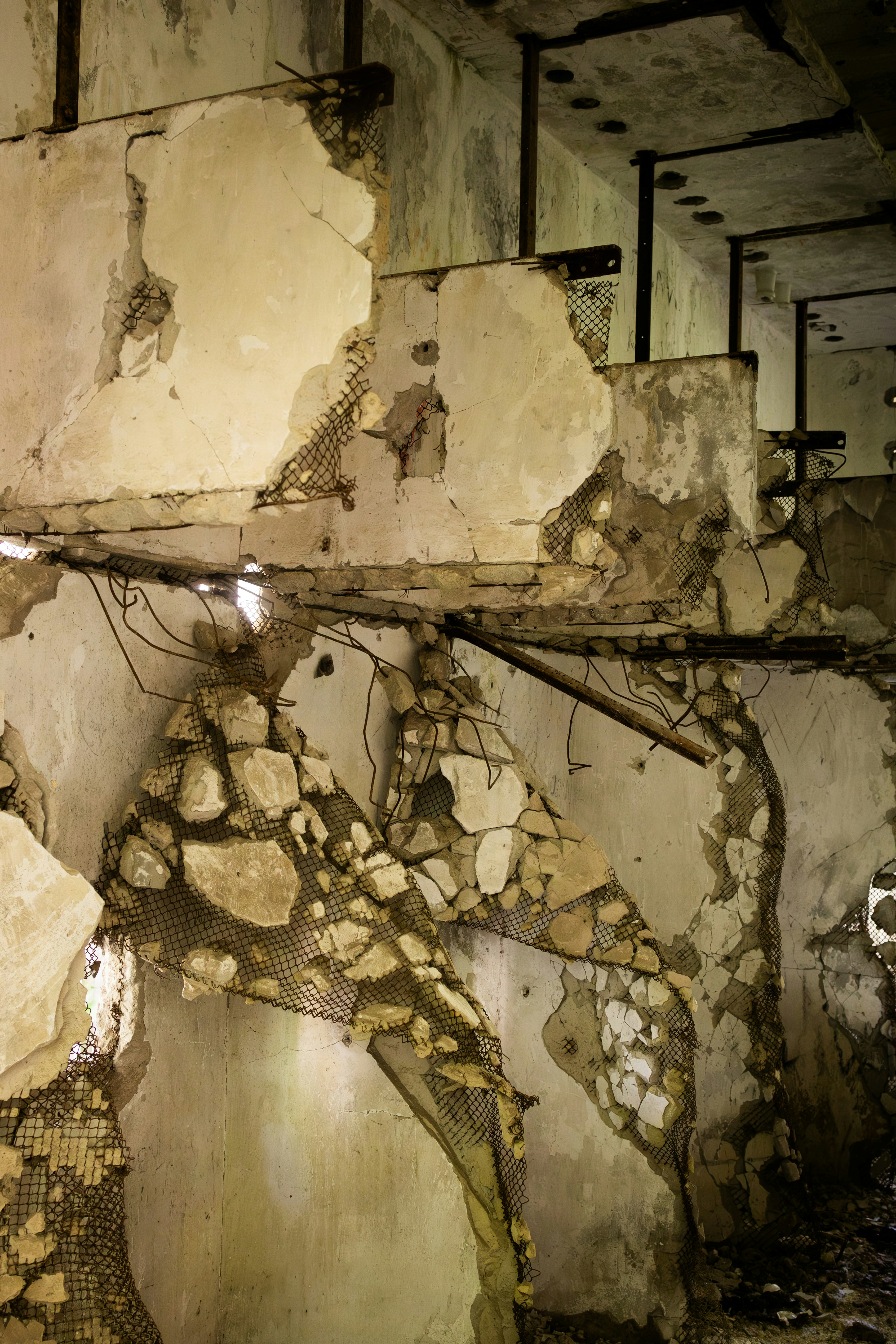 Crumbled Concrete Cathedral: A Tangle of Ruins in Dim Light