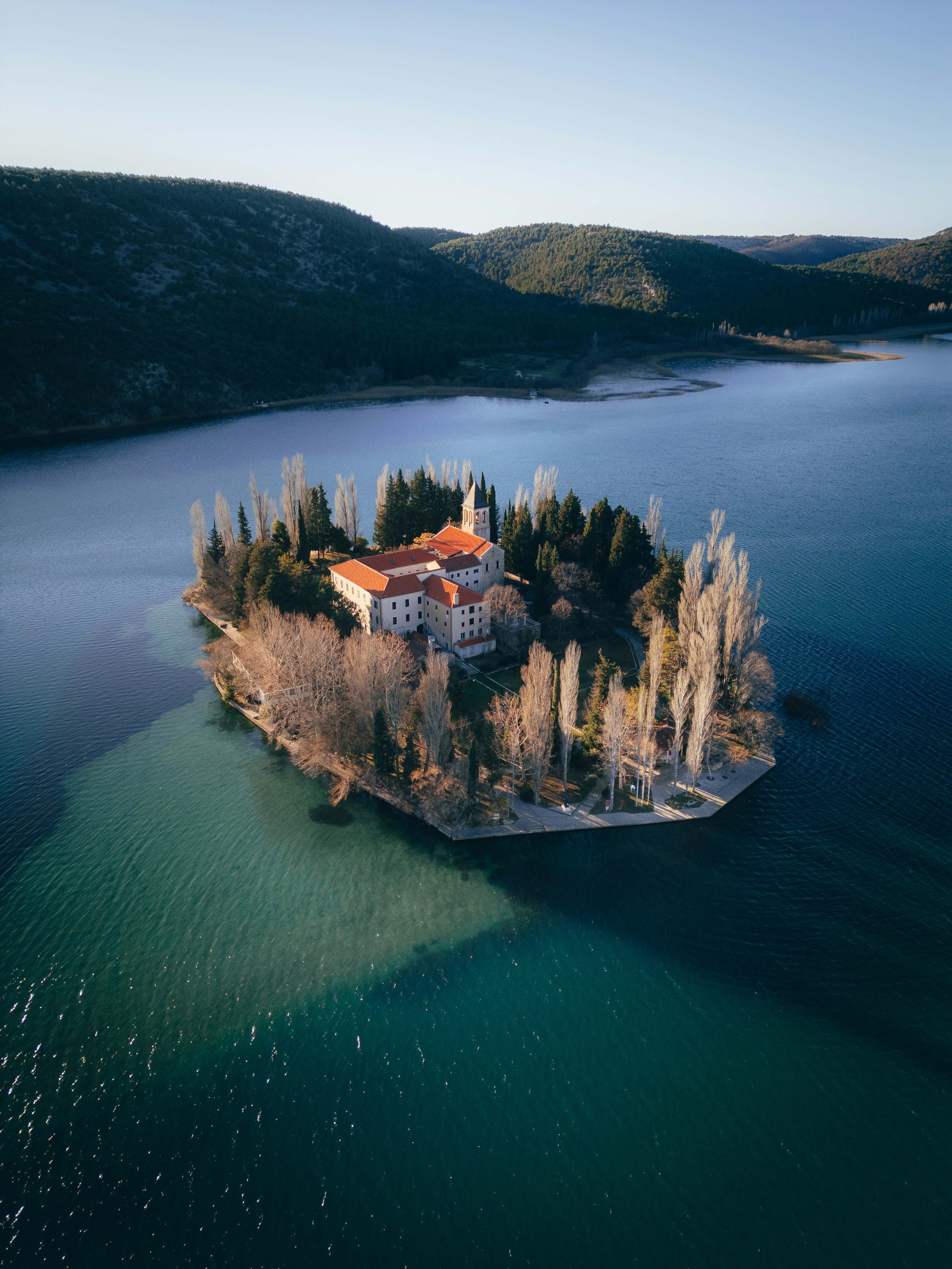 Isolated Abbey on a Stilled Lake Island