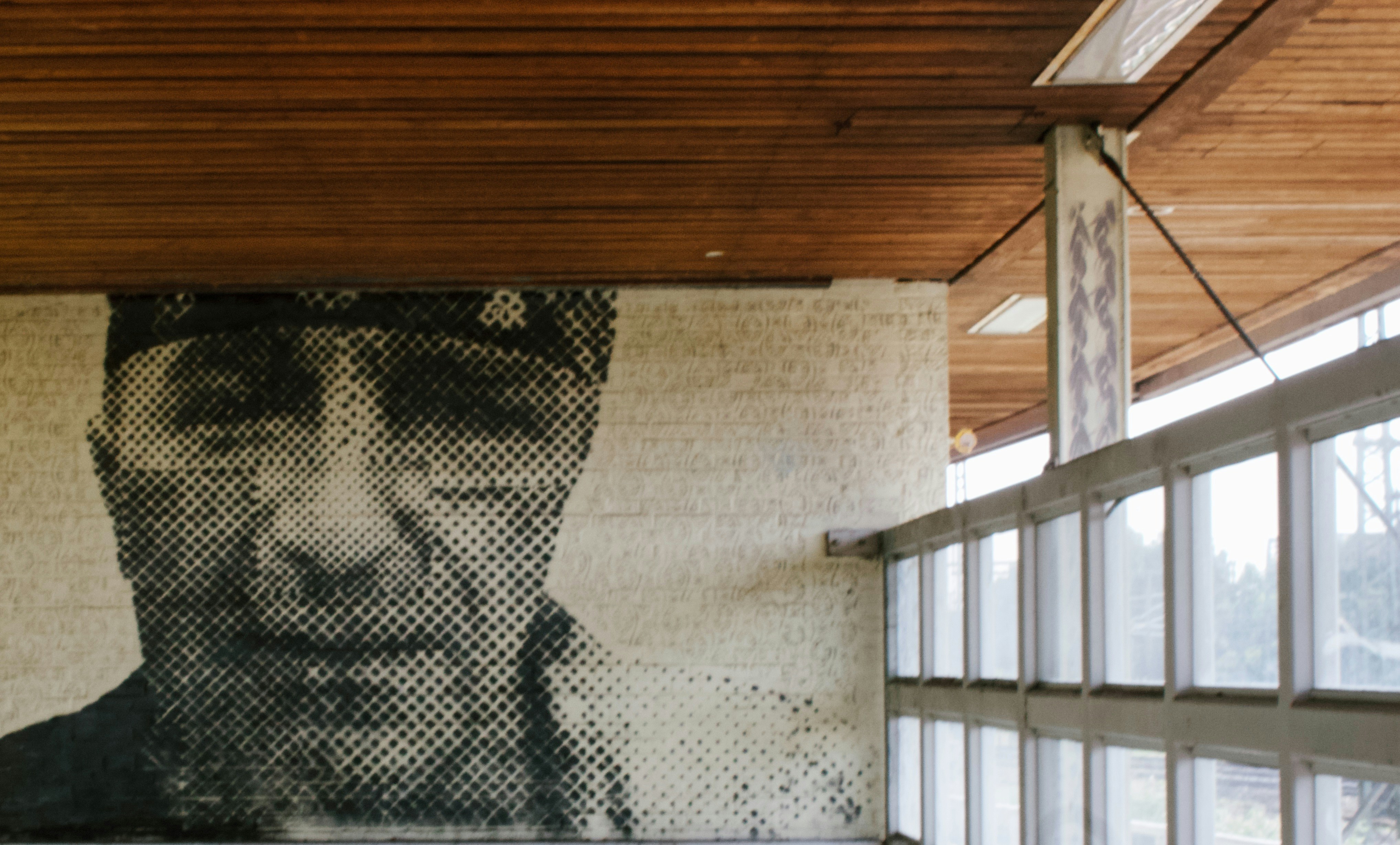 Portrait Mosaic on a Sunlit Wall