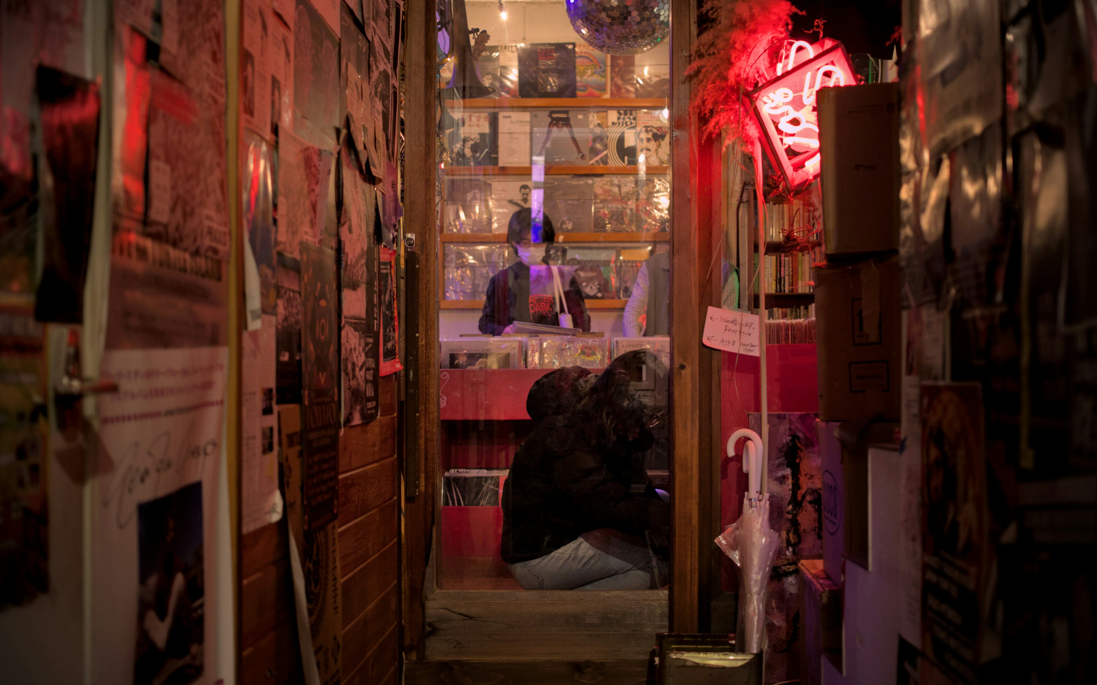 Neon Alley Concert: A Quiet Moment in a Dimly Lit Passage
