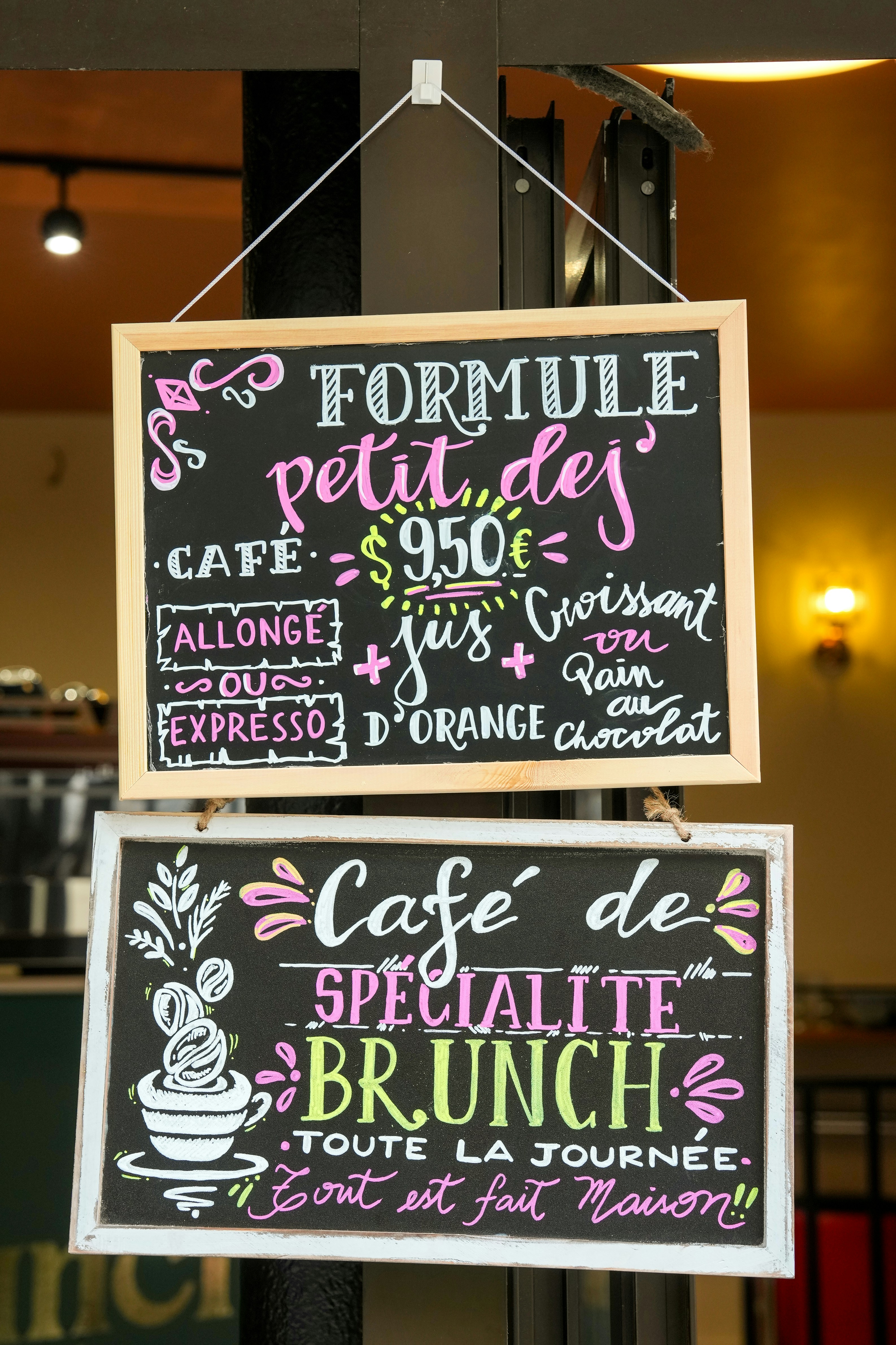 Chalkboard Charms: A Pair of Café Menus Framing a Warm Interior