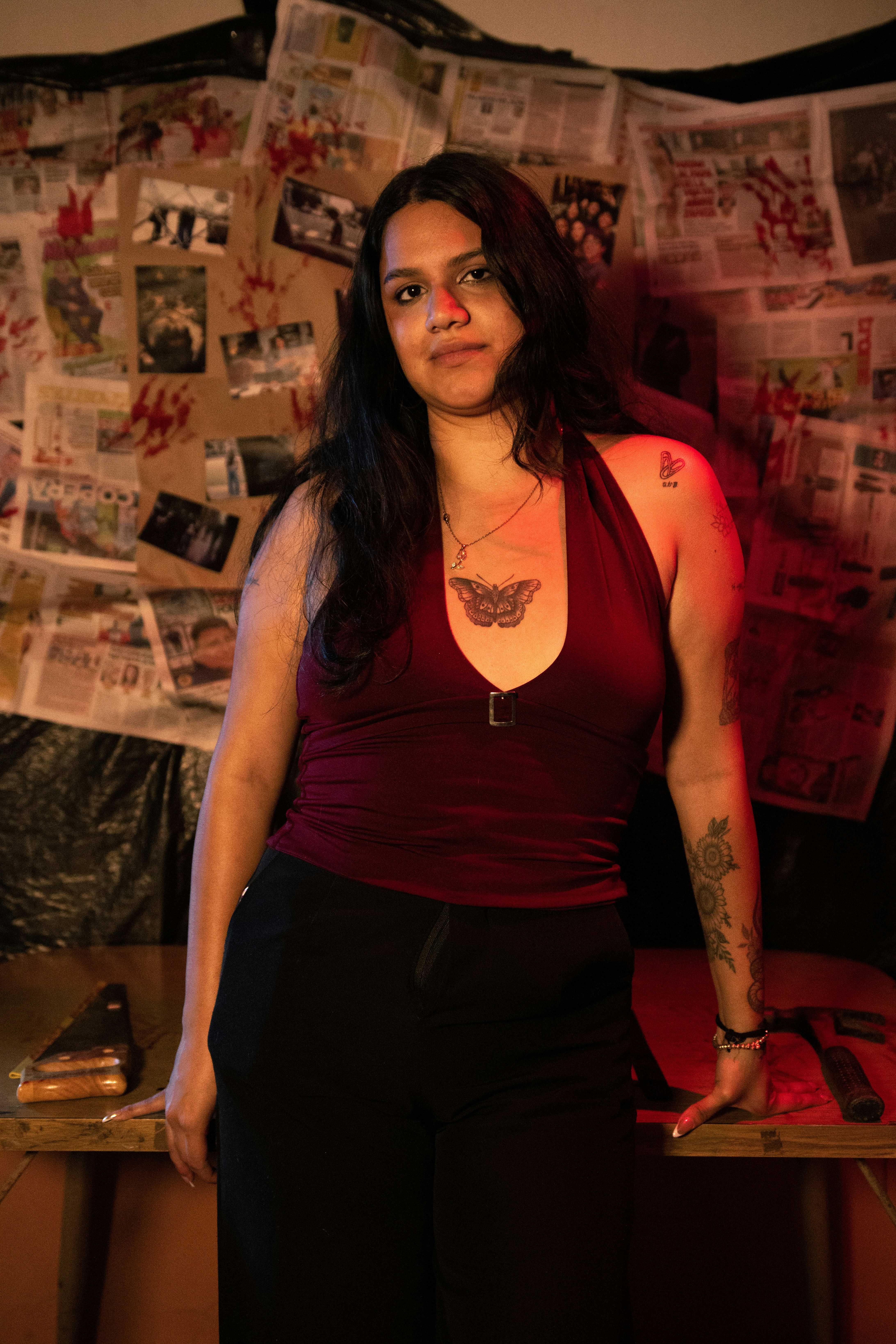 Midnight Spotlight: Tattooed Confidence in a Dim Wallpapered Studio