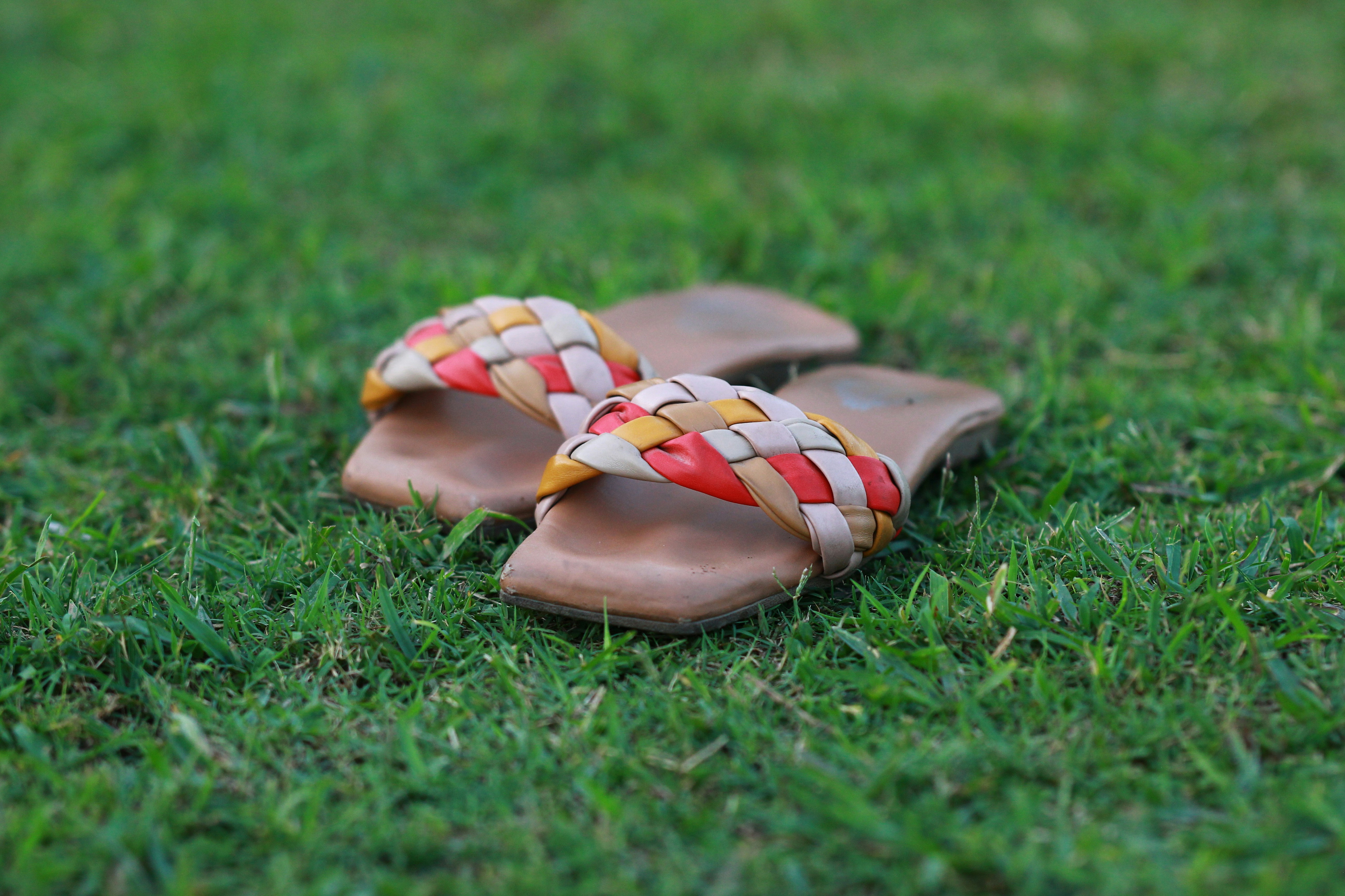 Braided Sandals Resting on Lush Grass