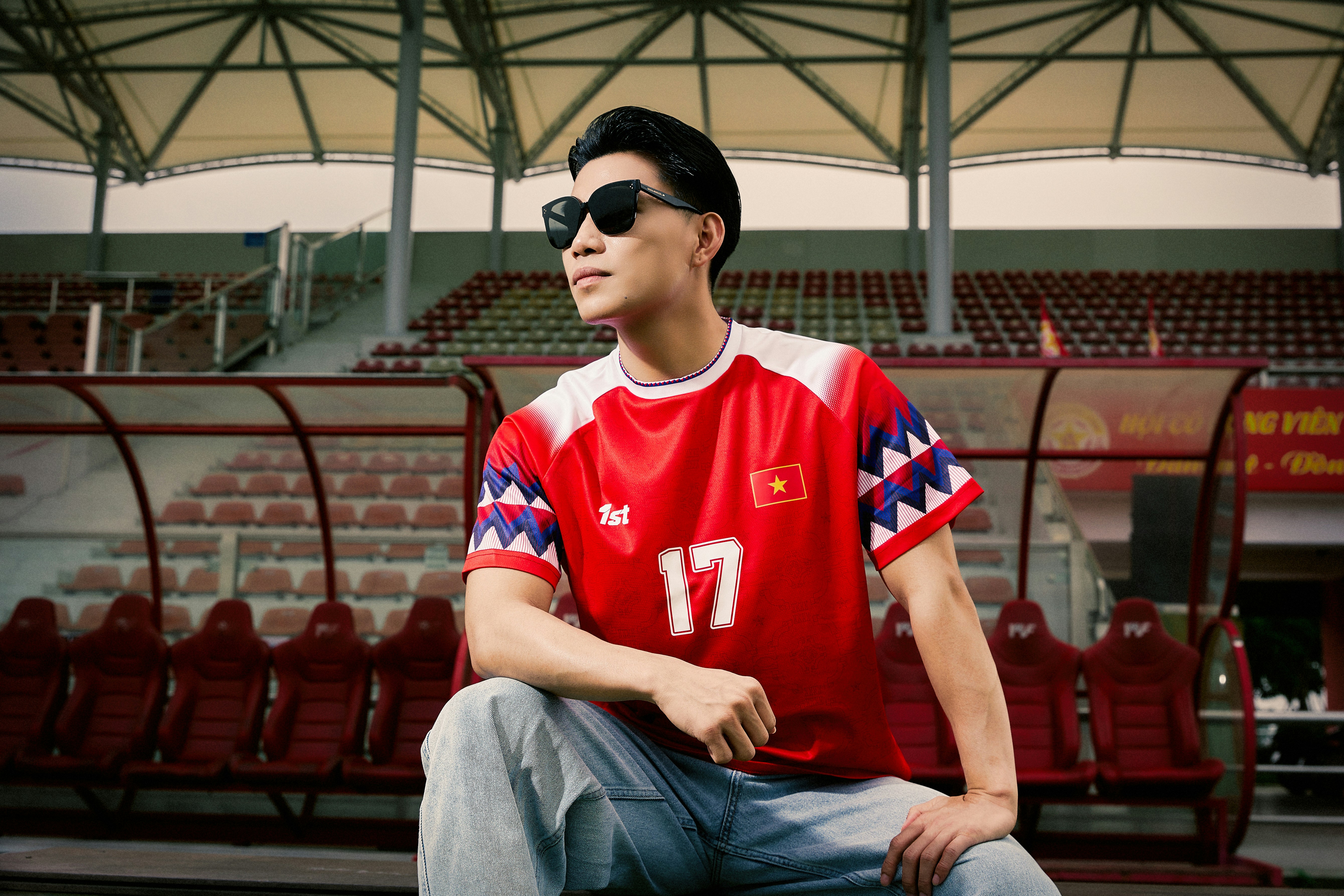Red-jersey silhouette in a stadium lounge