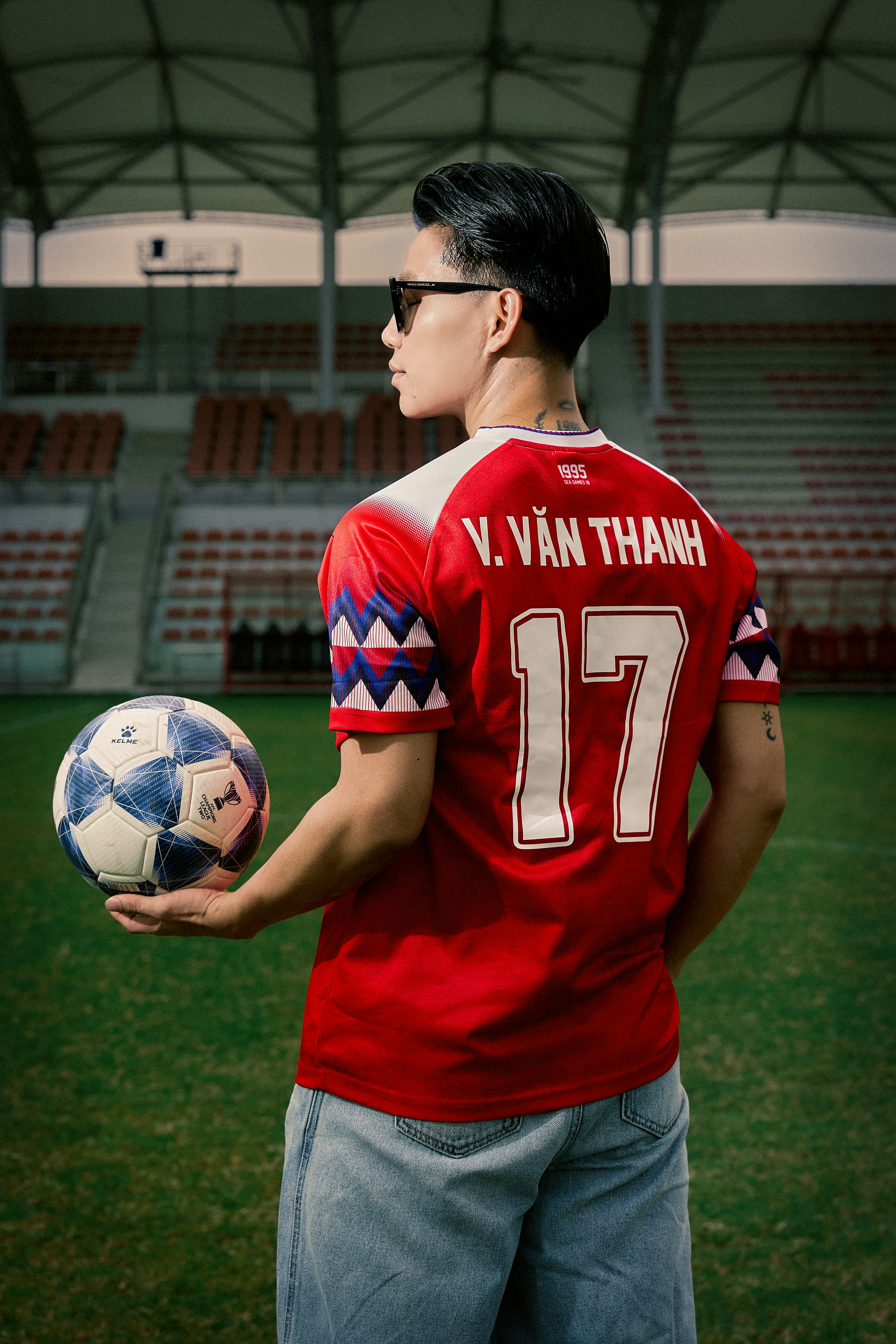 Red Jersey, Green Pitch: The Player with the Ball