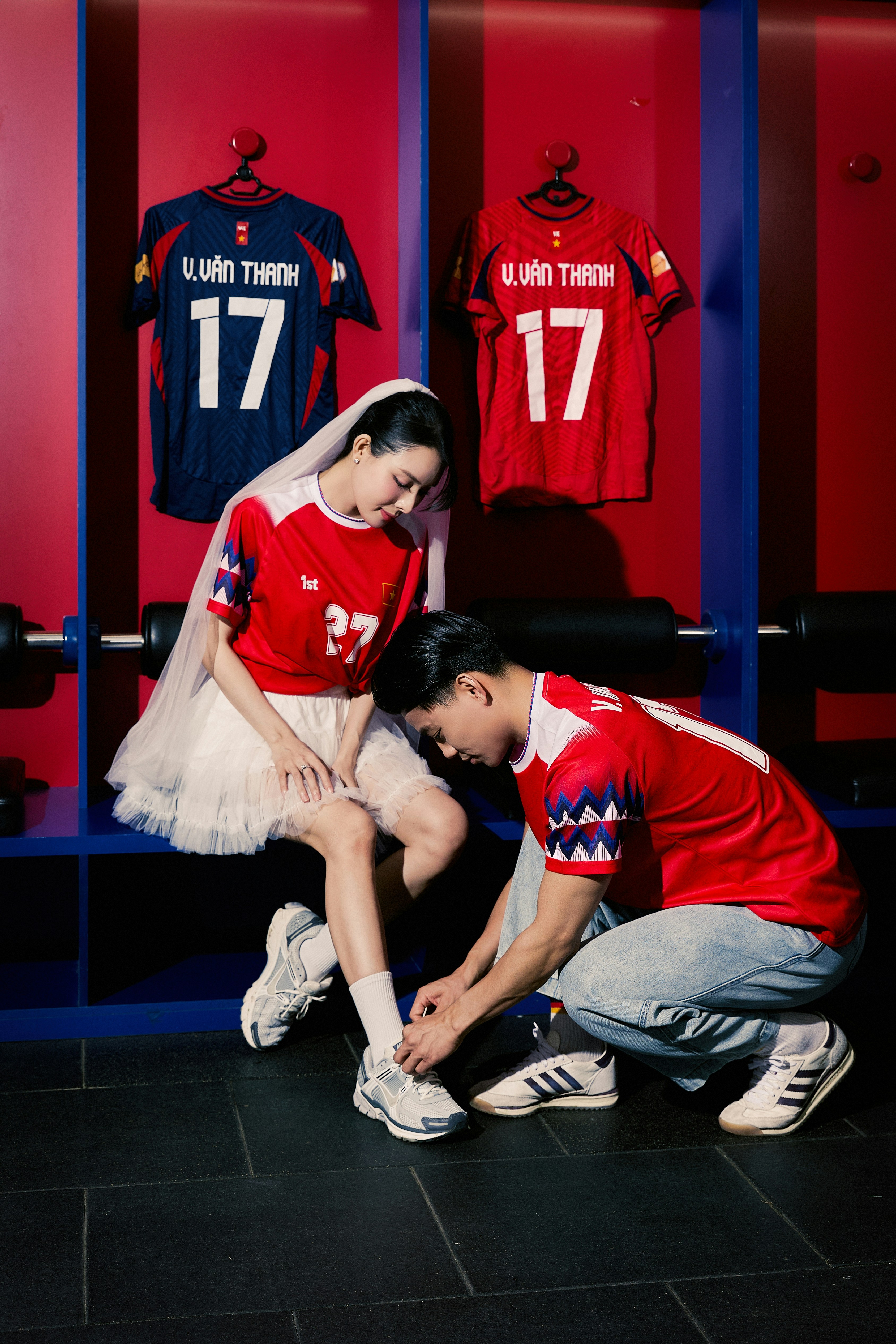 Locker Room duet: a bride-to-be helps her partner lace up before the big game