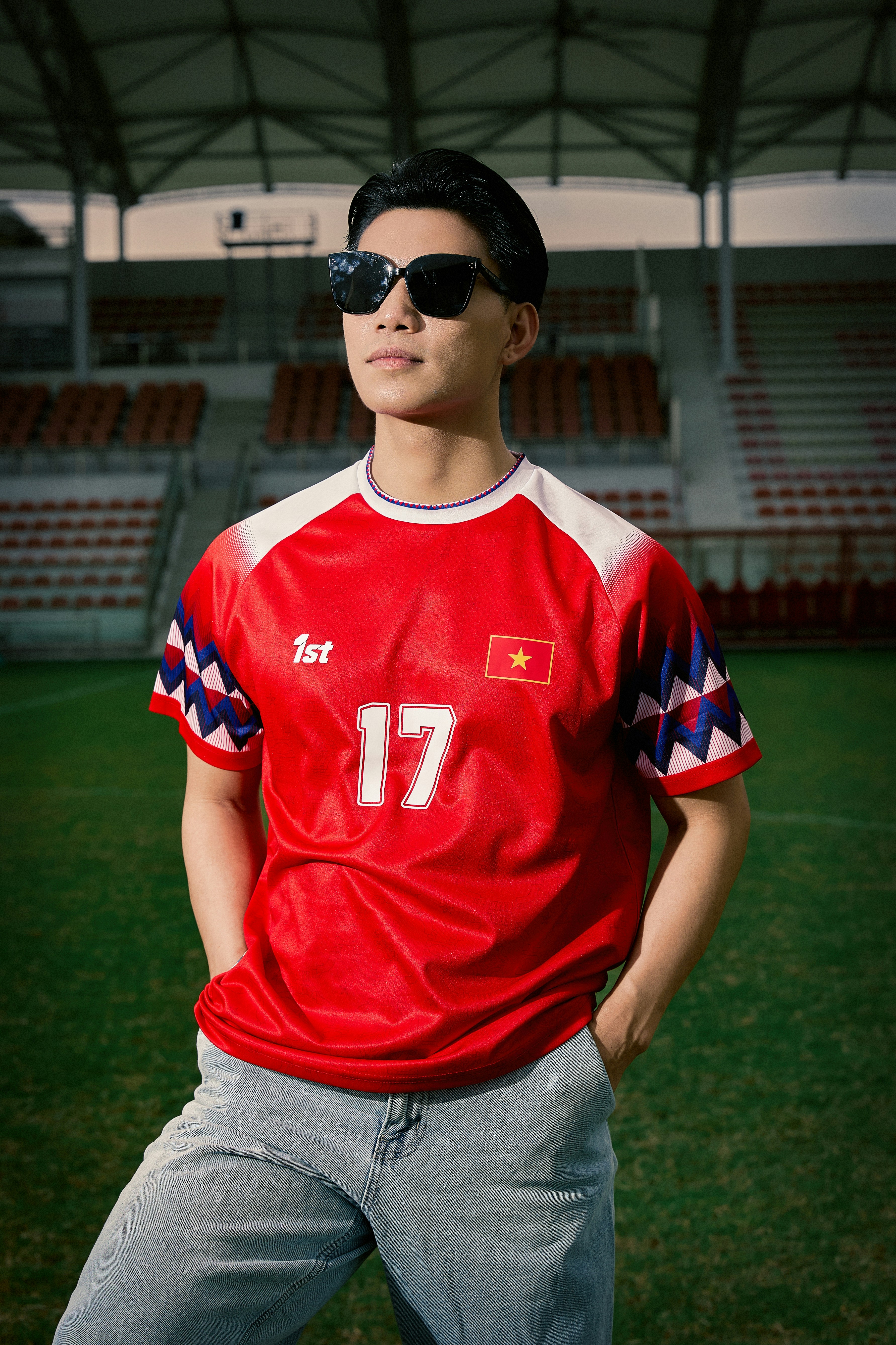 Red Jersey, Cold Stadium: Portrait of Focused Confidence