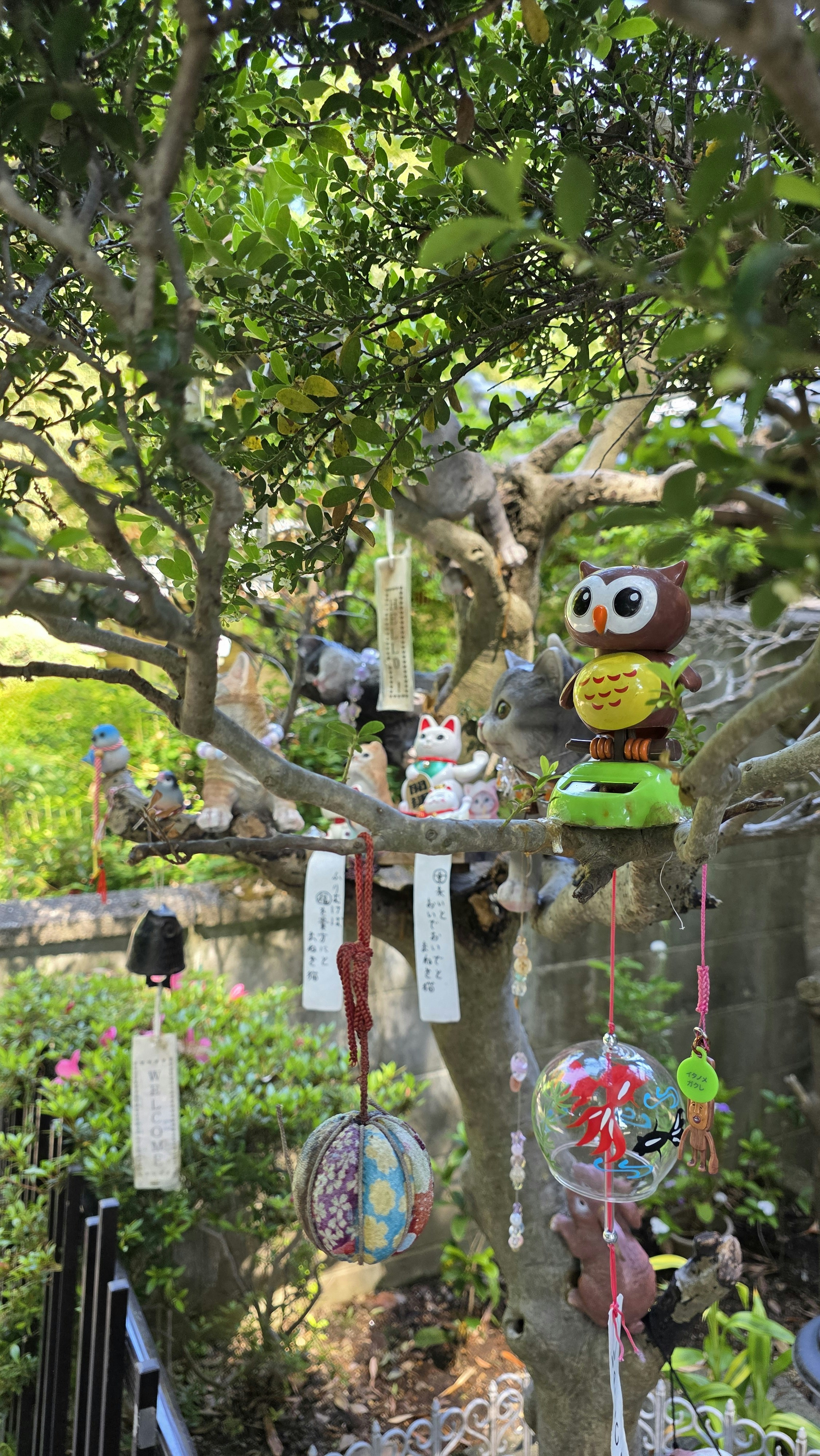 Whimsical Owl Keeper: A Tree of Ornaments and Charms