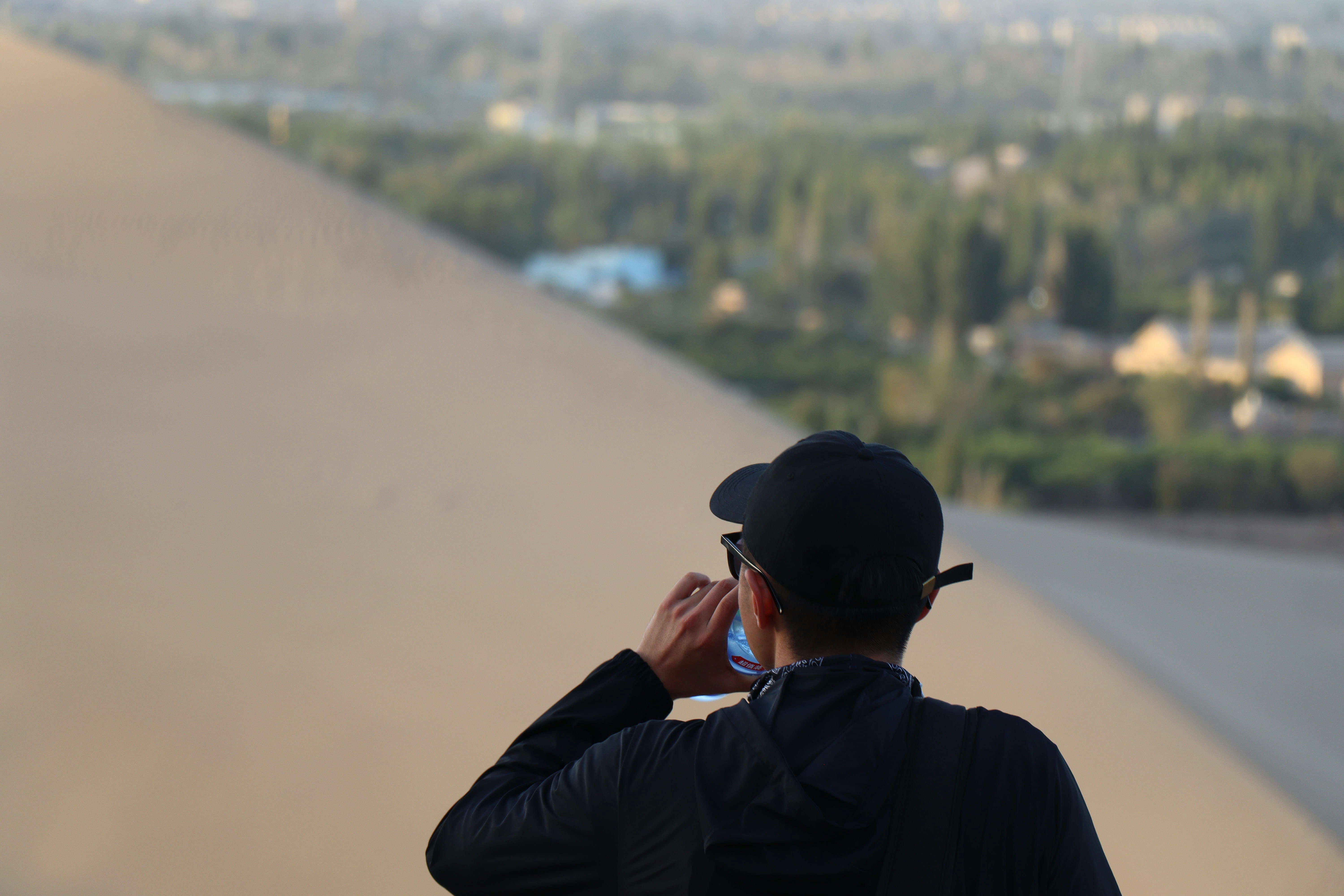 Horizon Echoes: A lone photographer at dune’s edge